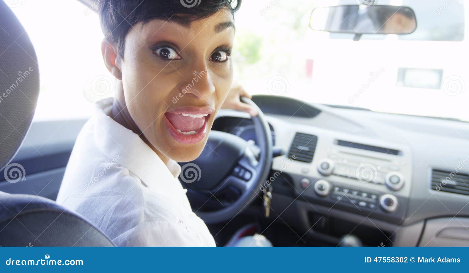 Angry Woman in Car Looking Over Shoulder and Shouting at Passenger ...