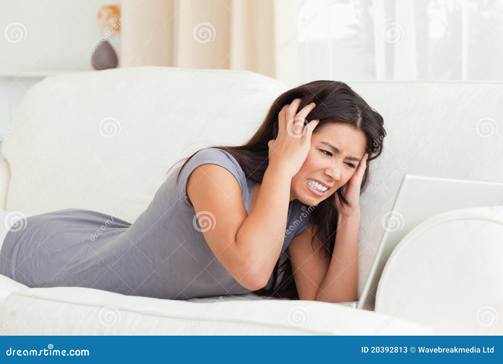 Angry Woman Lying on Sofa with Notebook Stock Image - Image of computer ...