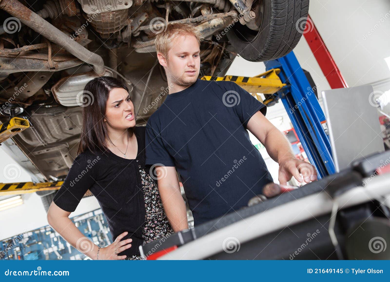 Angry woman with mechanic stock image. Image of auto - 21649145