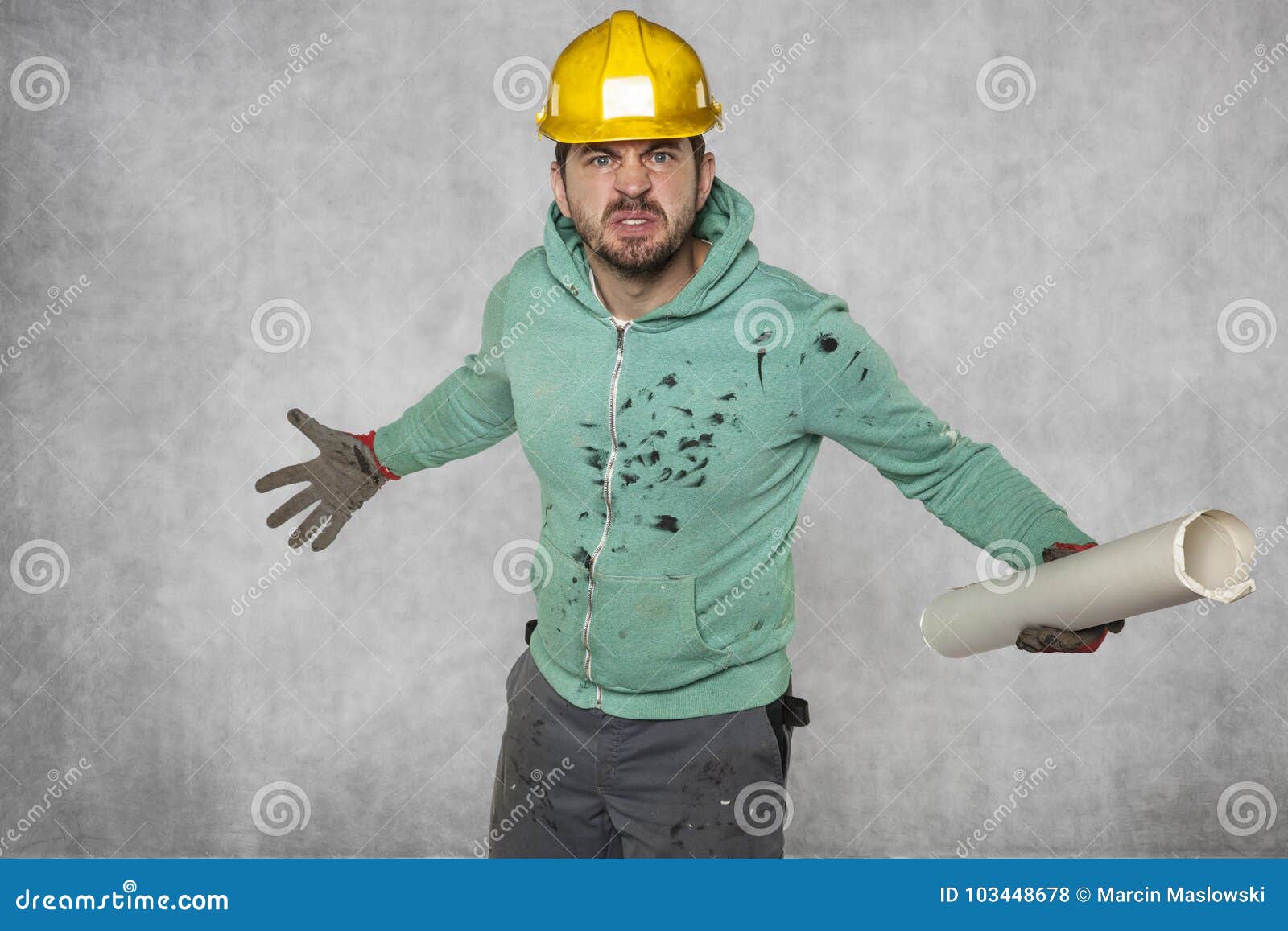 An Angry Worker with Construction Plans Stock Photo - Image of ...