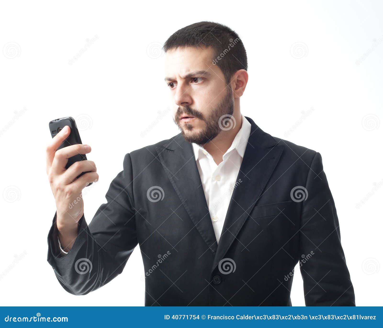 Angry Young Businessman Looking Mobile Phone. Stock Photo - Image of ...