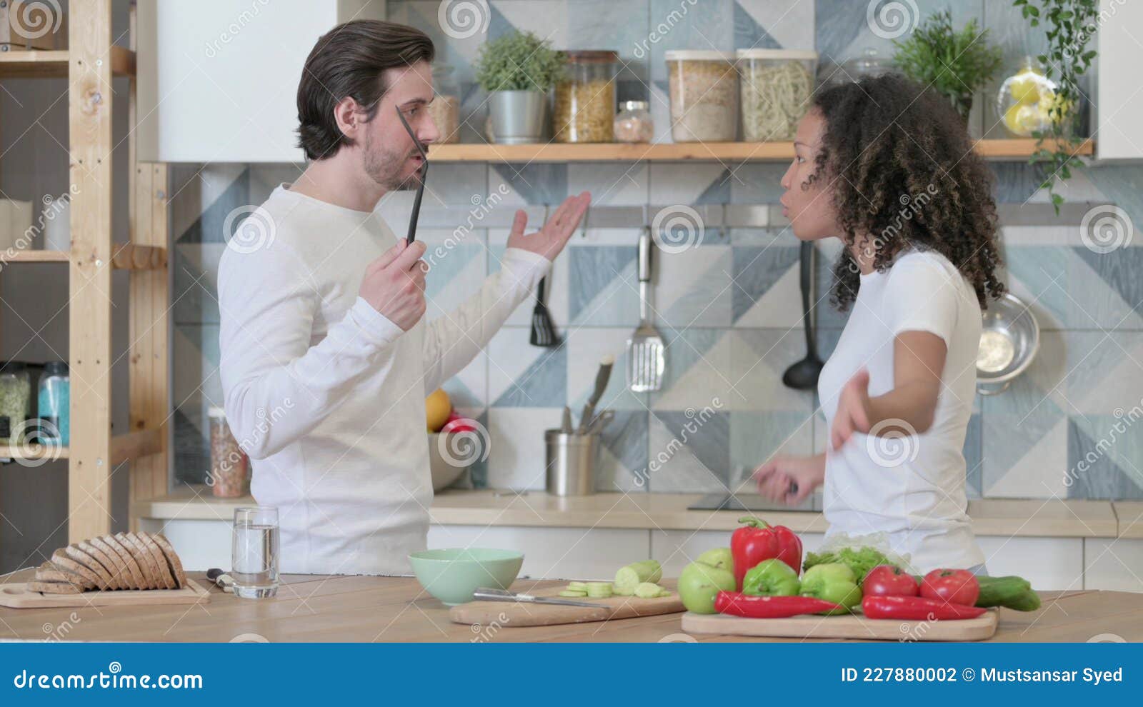 Angry Young Couple Arguing in Kitchen Stock Photo - Image of kitchen ...