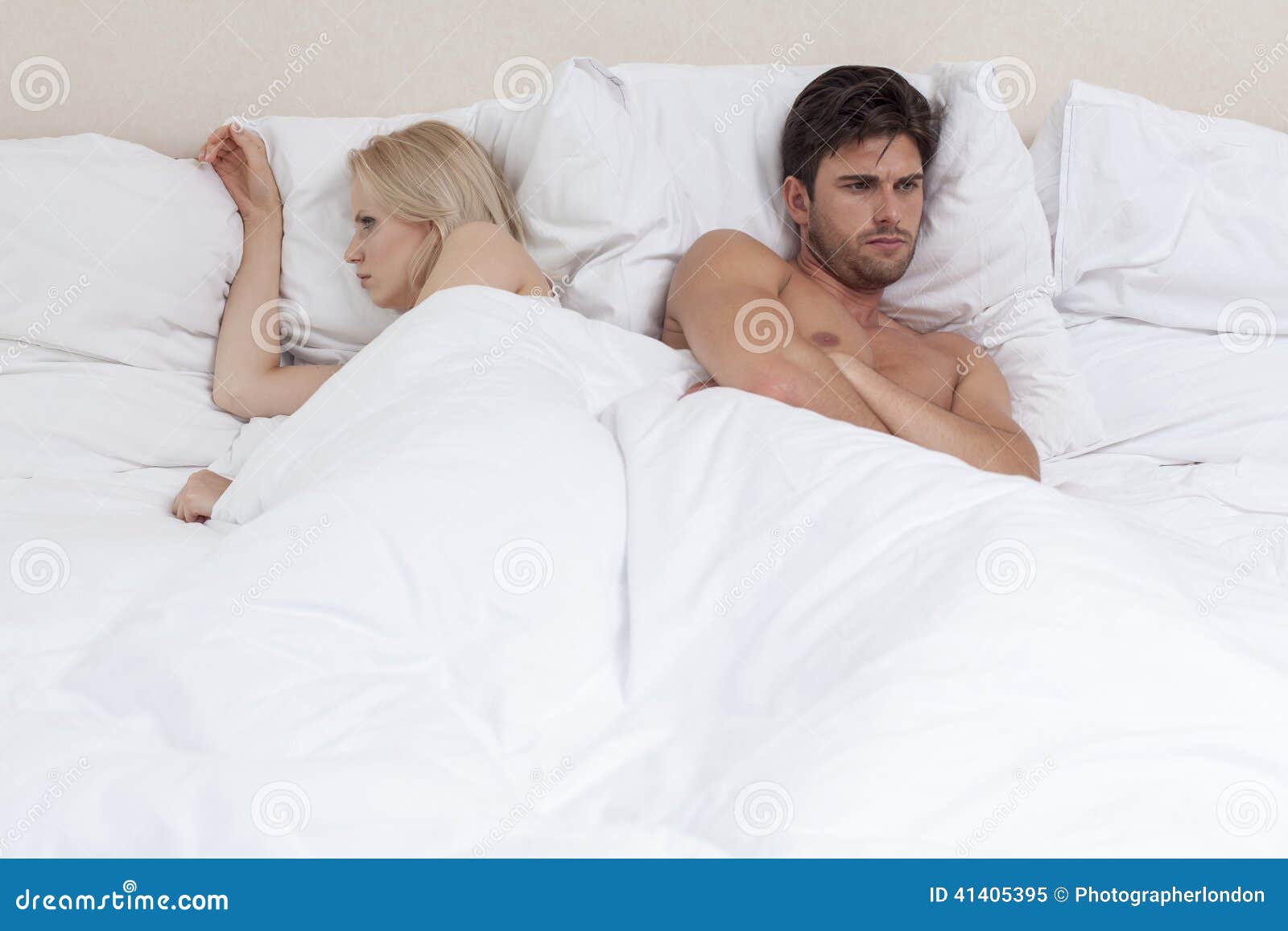 Angry Young Couple Lying in Bed Stock Image - Image of crossed ...