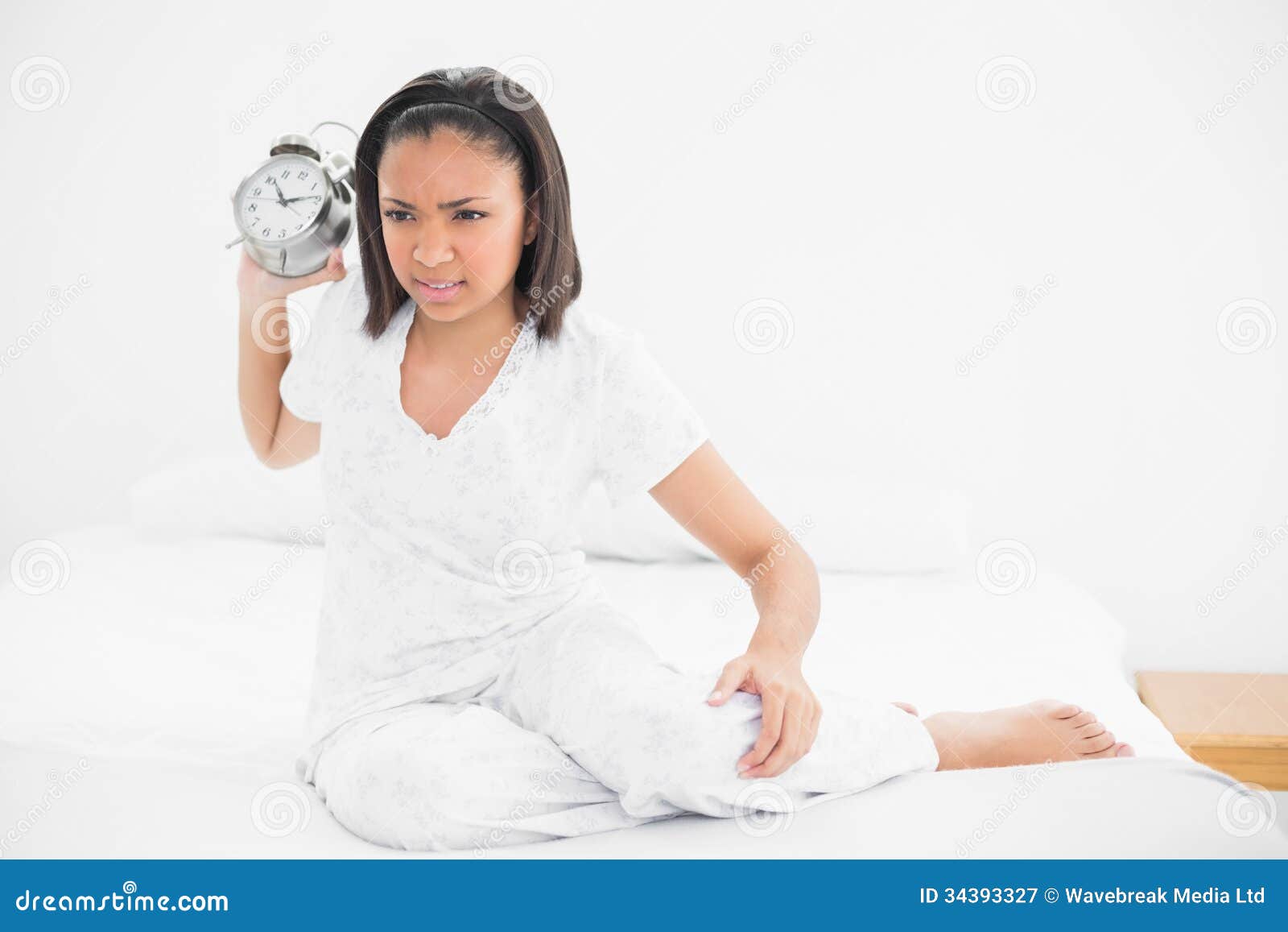 Angry Young Dark Haired Model Throwing an Alarm Clock Stock Image ...