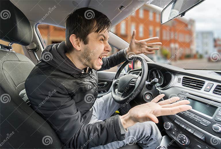 Angry Young Driver is Driving a Car and Shouting Stock Photo - Image of ...