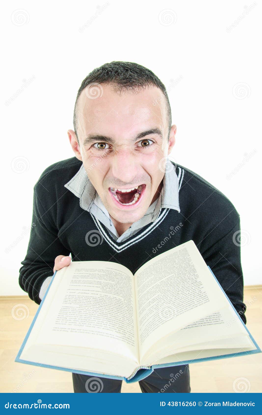 Angry Young Man Holding a Book Tired of Reading Stock Photo - Image of ...