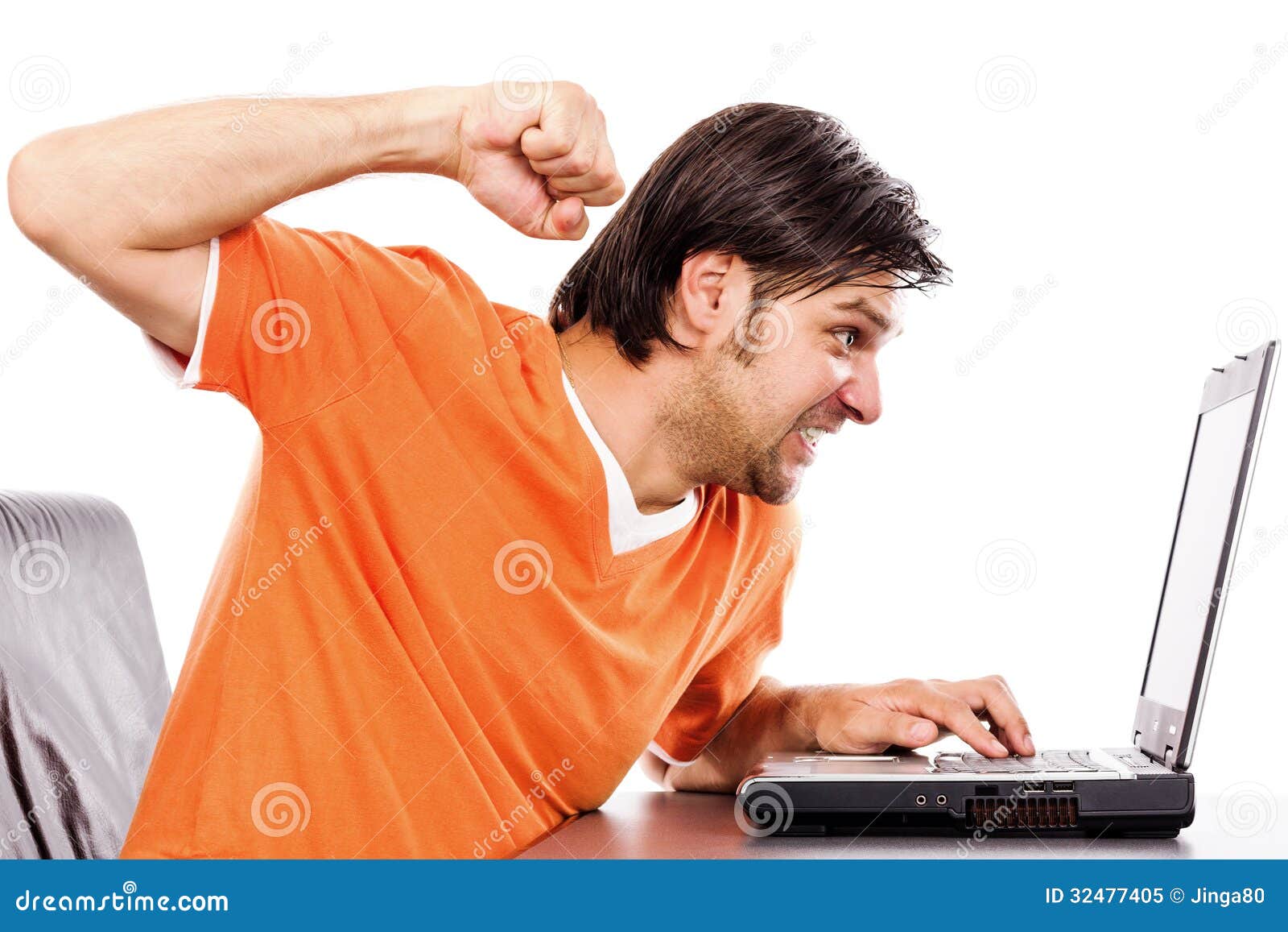 Angry young man at laptop stock image. Image of computer - 32477405