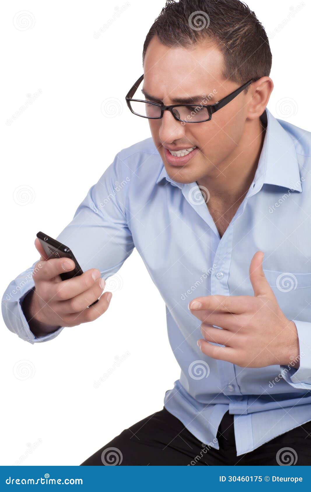 Angry Young Man Looking at His Mobile Phone Stock Image - Image of ...