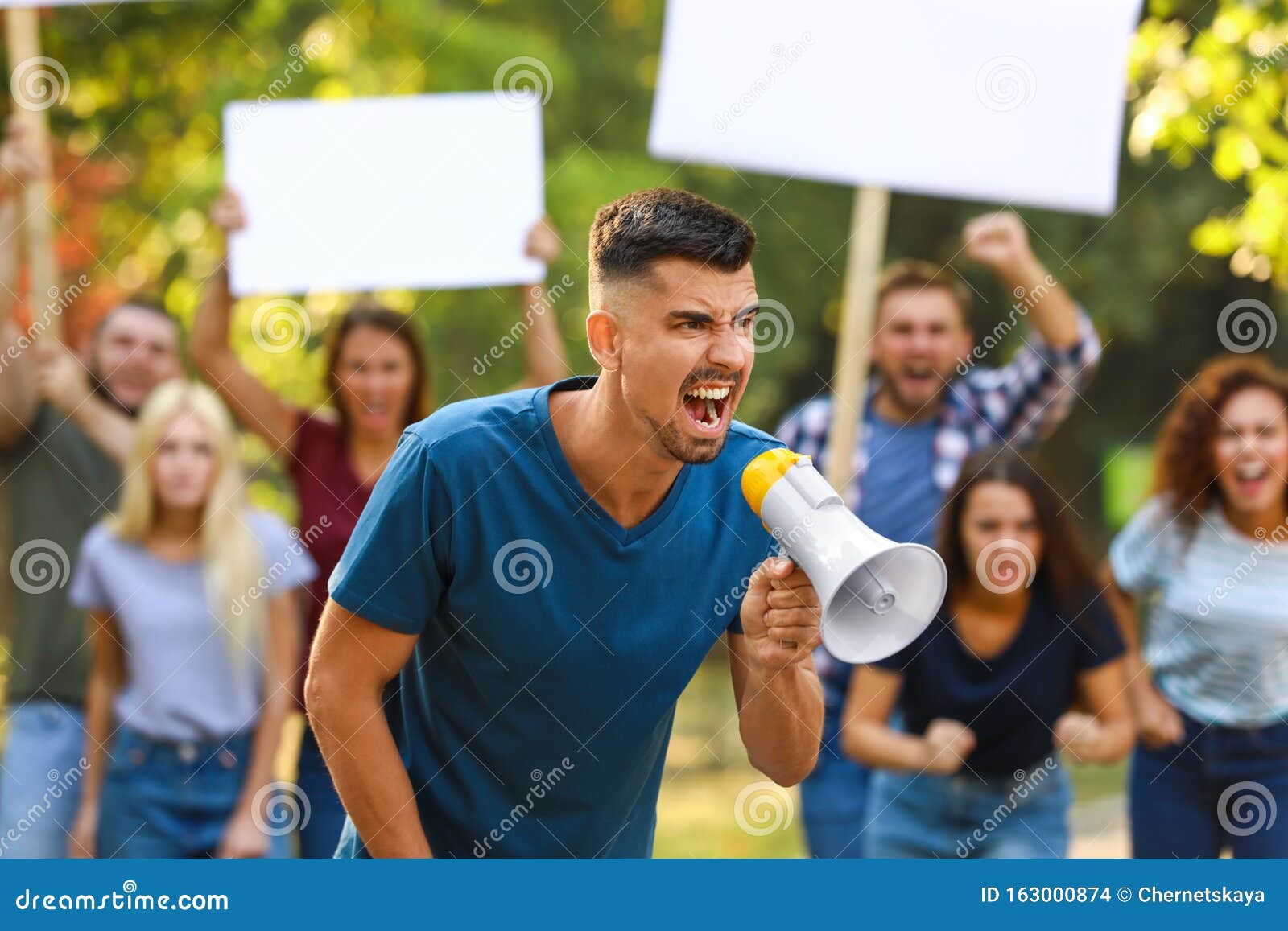 Angry Young Man with Megaphone at Protest Stock Photo - Image of ... Angry Young Man with Megaphone at Protest Stock Photo - Image of ...