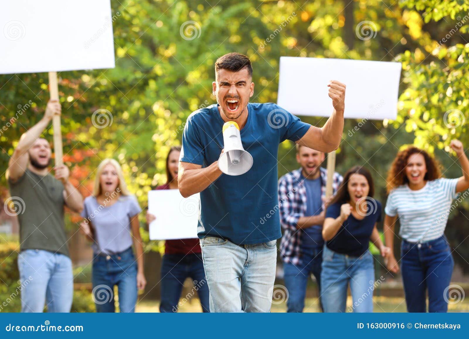 Angry Young Man with Megaphone at Protest Stock Photo - Image of banner ... Angry Young Man with Megaphone at Protest Stock Photo - Image of banner ...