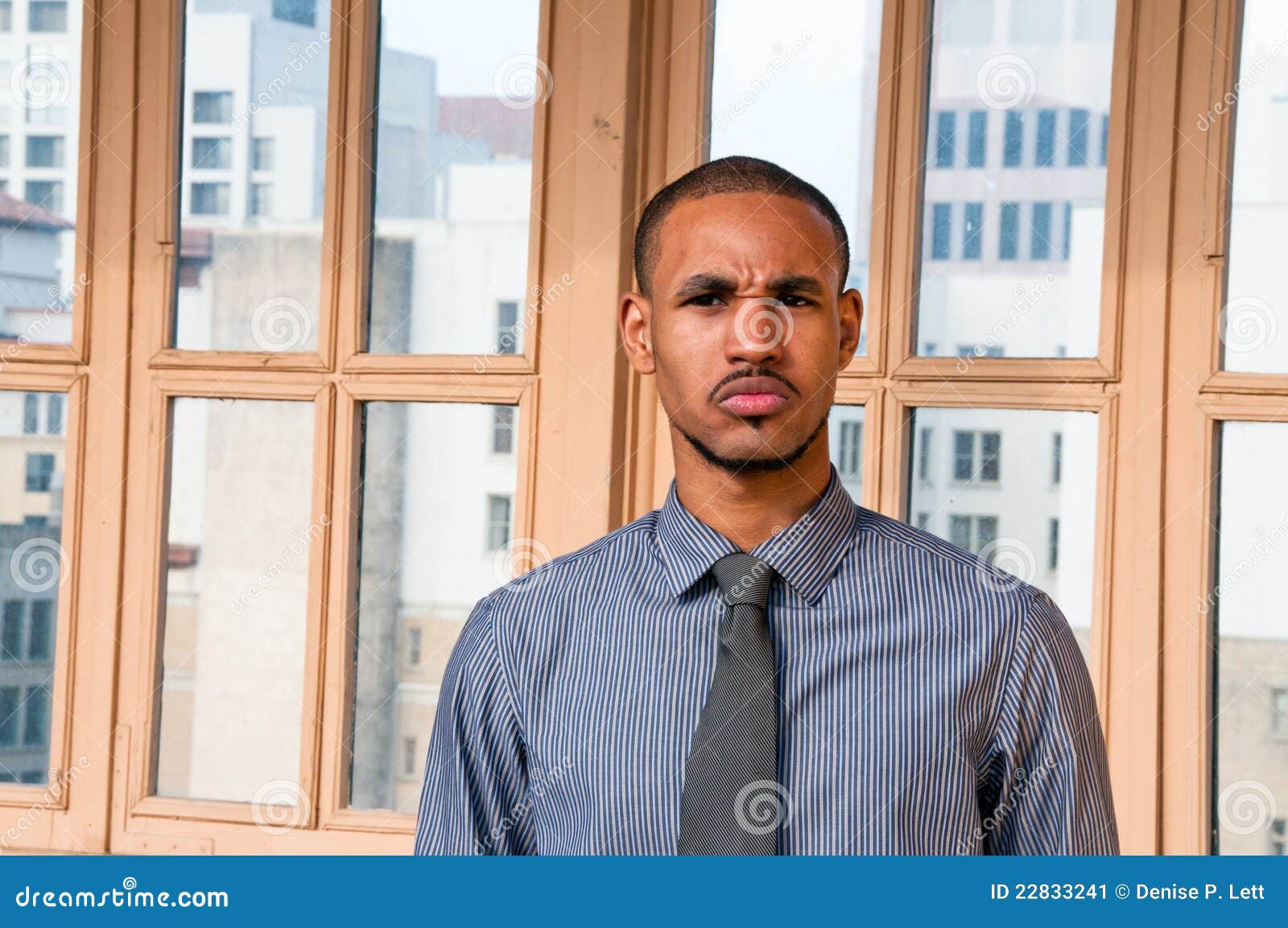 Angry Young Man Scowling stock image. Image of african - 22833241