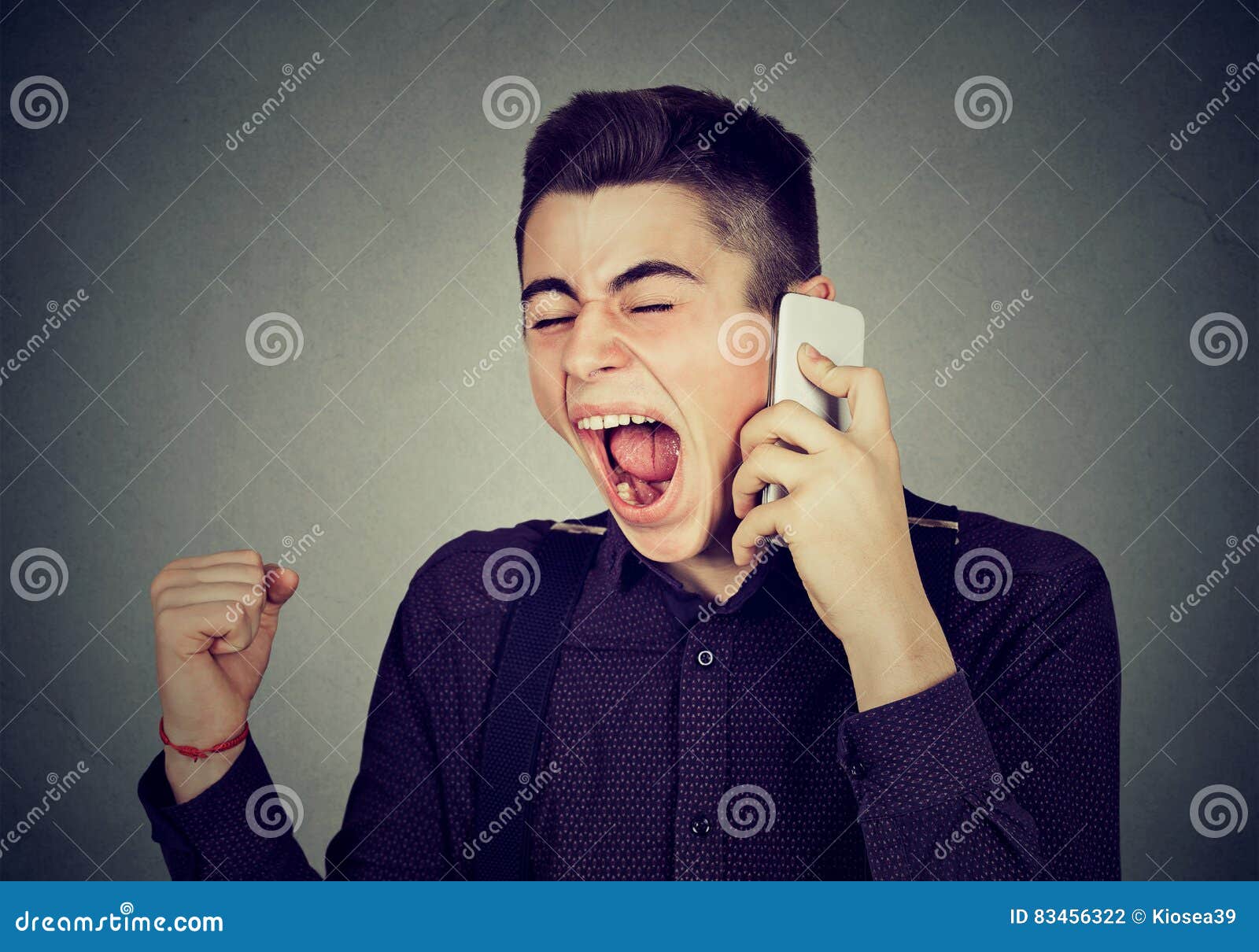 Angry Young Man Screaming on Mobile Phone Stock Photo - Image of ...