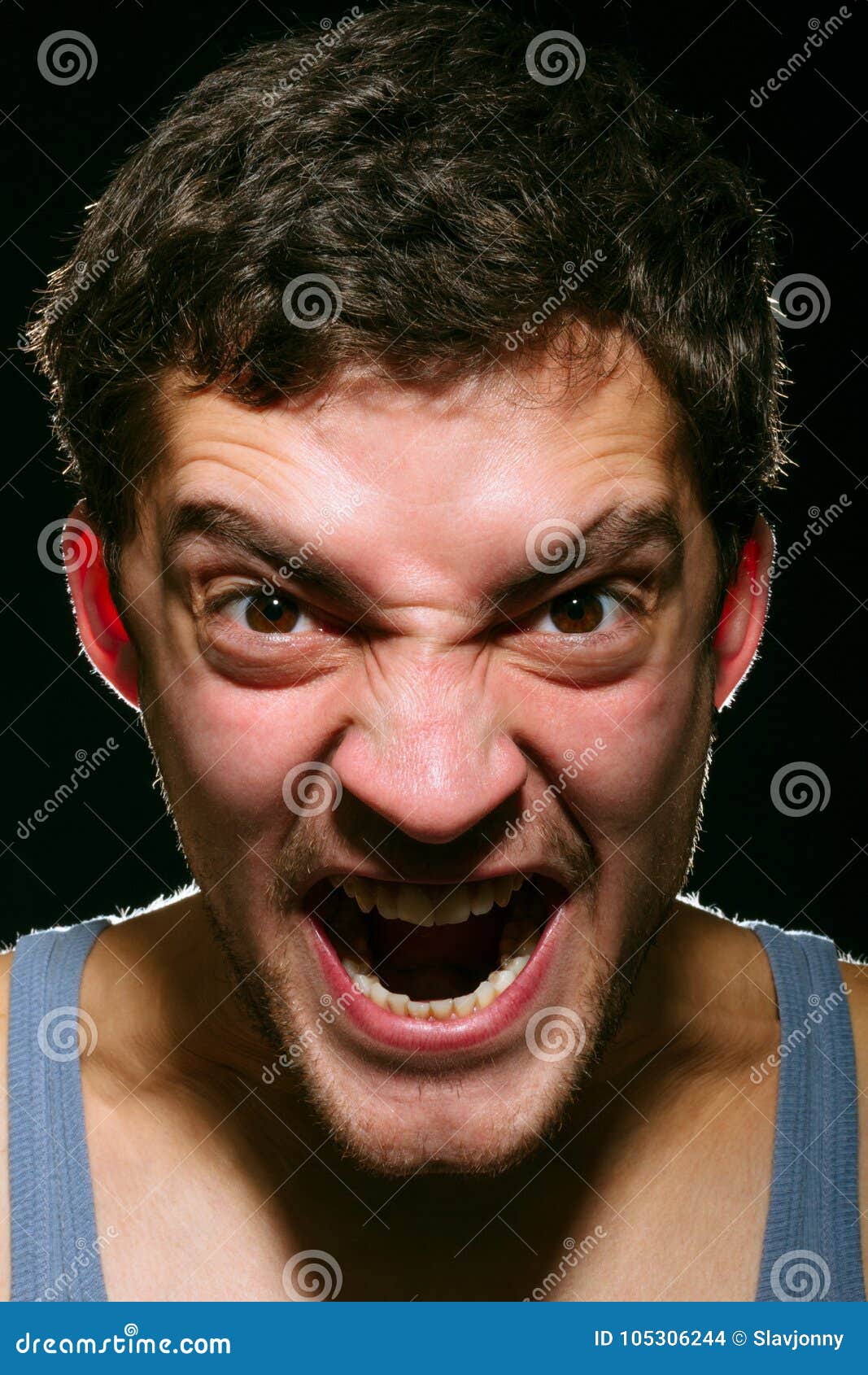 Angry young man shouting. stock photo. Image of mouth - 105306244