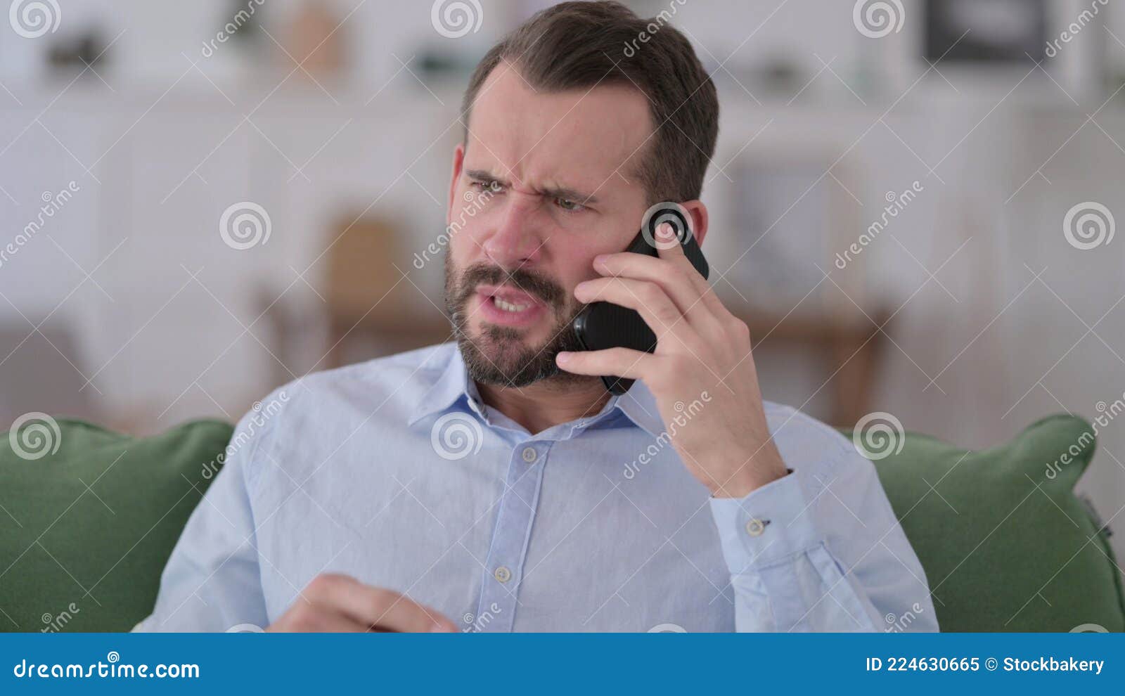 Angry Young Man Talking on Phone Stock Image - Image of casual ...