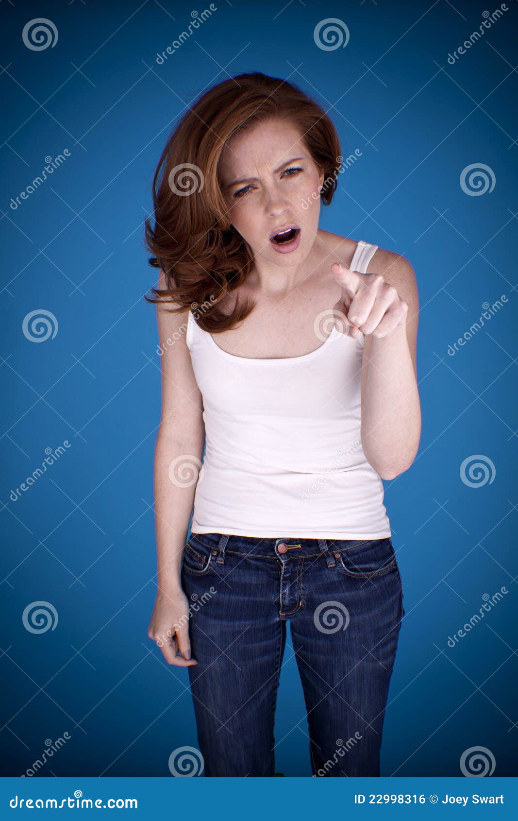 Angry young woman. stock photo. Image of emotion, point - 22998316