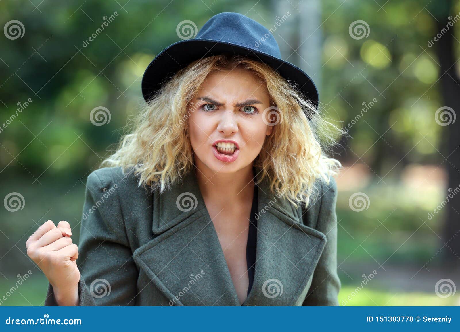 Angry young woman outdoors stock photo. Image of hysterics - 151303778