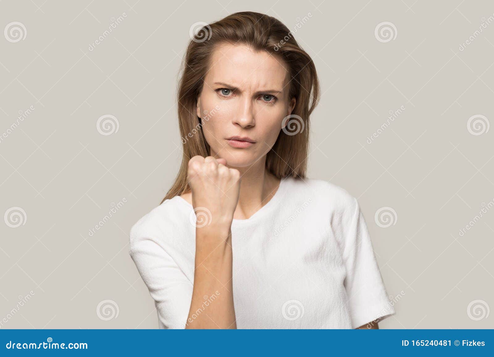 Angry Young Woman Showing Clenched Fist at Camera, Warning Stock Image ... Angry Young Woman Showing Clenched Fist at Camera, Warning Stock Image ...