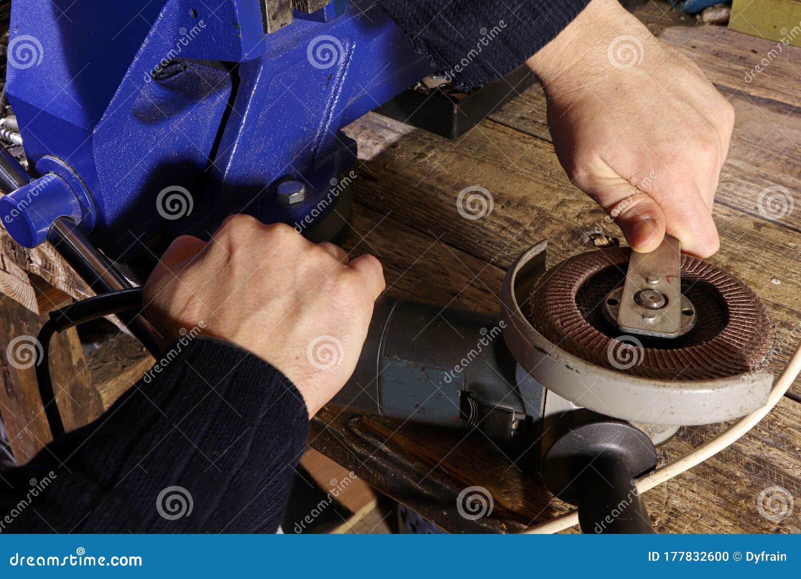 Angular Grinding Machine. Blue Vise on a Wooden Table. Bench Tools ...