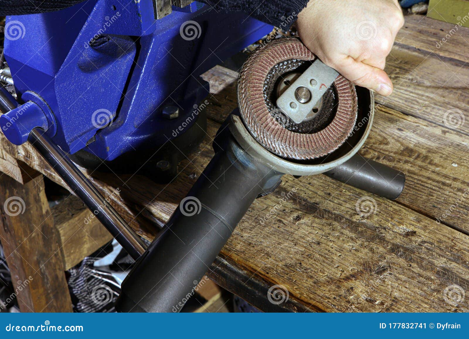 Angular Grinding Machine. Blue Vise on a Wooden Table. Bench Tools ...