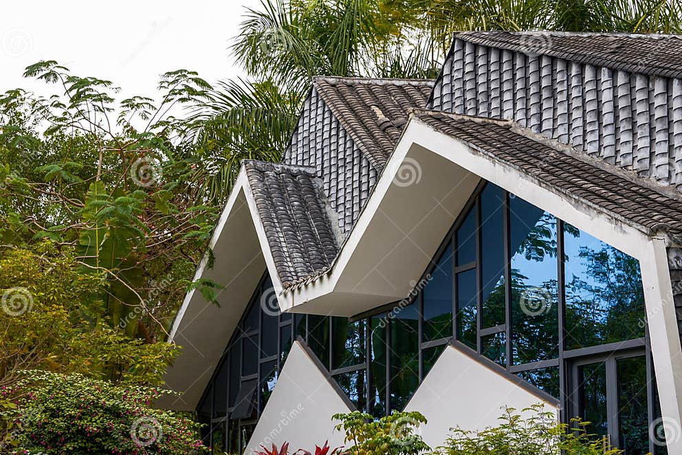 An Angular Modern Building in a Forest Stock Photo - Image of property ...