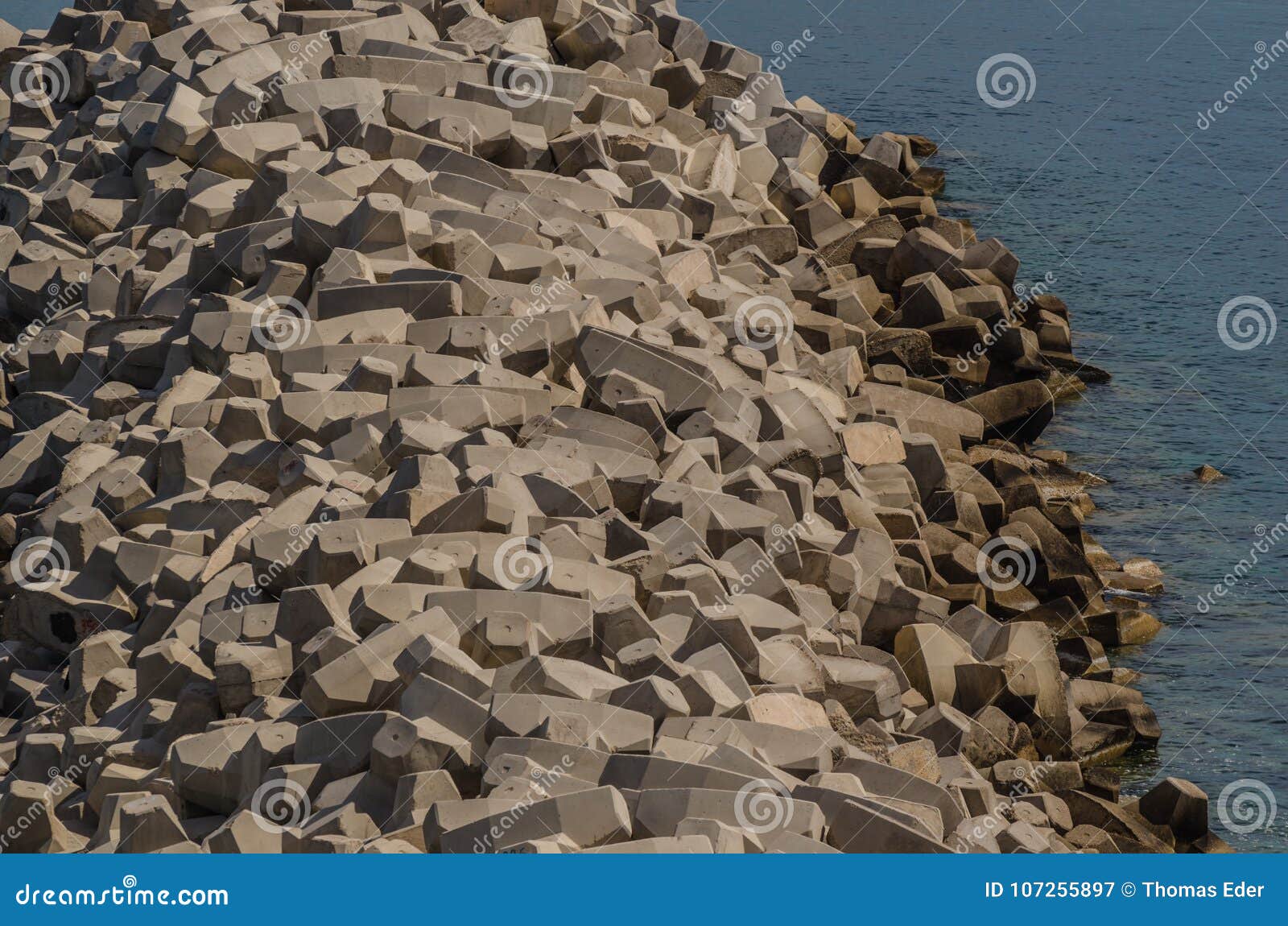 Angular stones on the sea stock image. Image of clear - 107255897