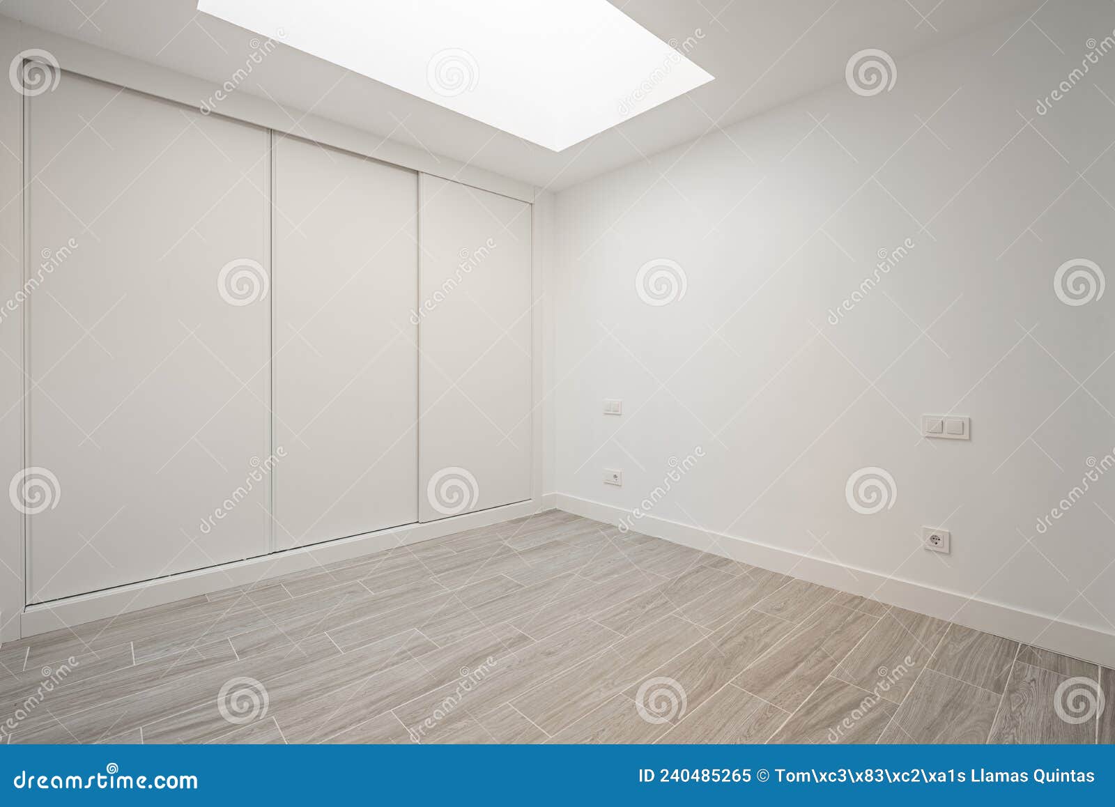 Angular View of a Built-in Wardrobe with White Sliding Doors Stock ...