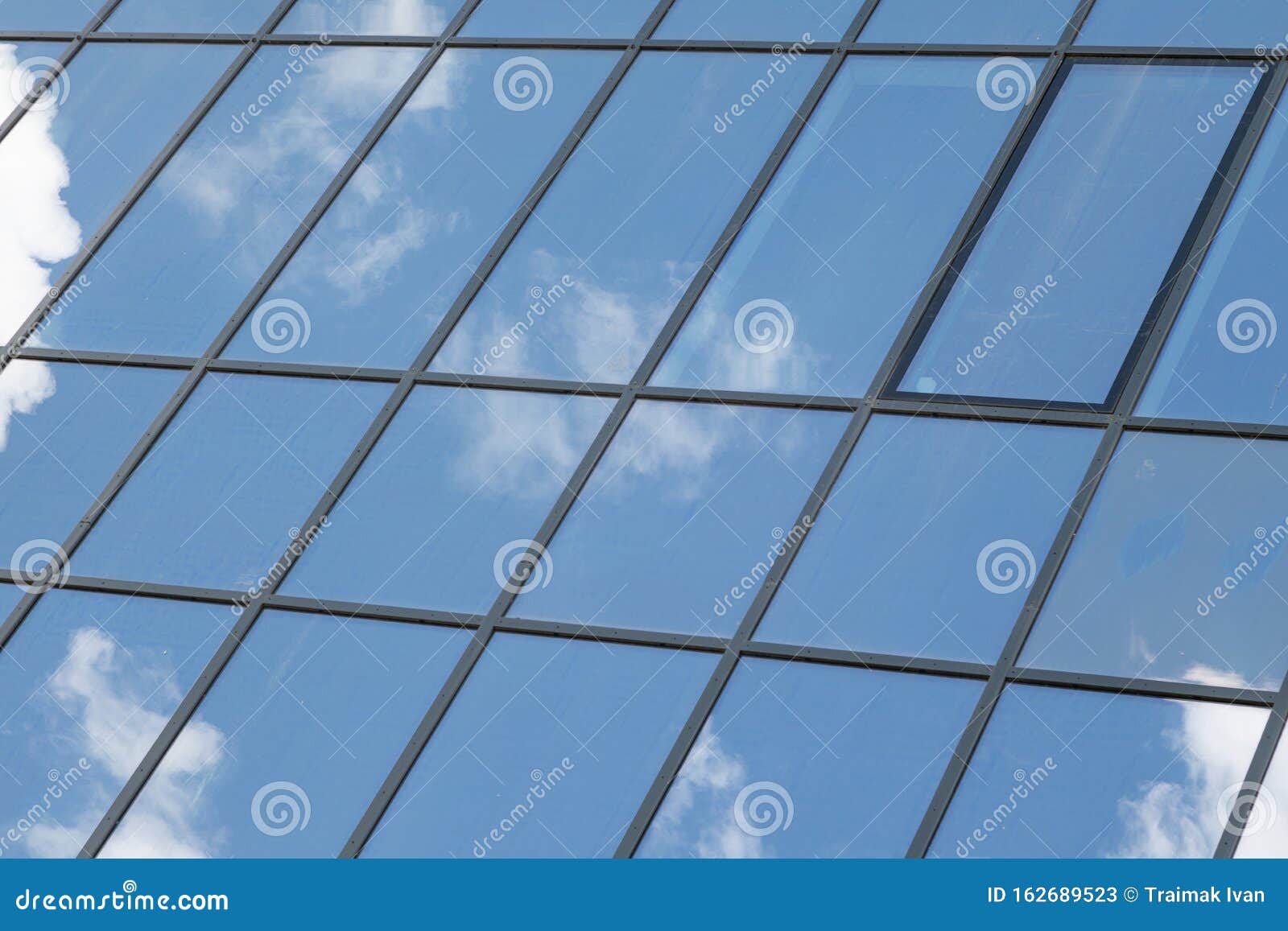 Angular View of Modern Glass Building with Sky Reflection on Windows ...