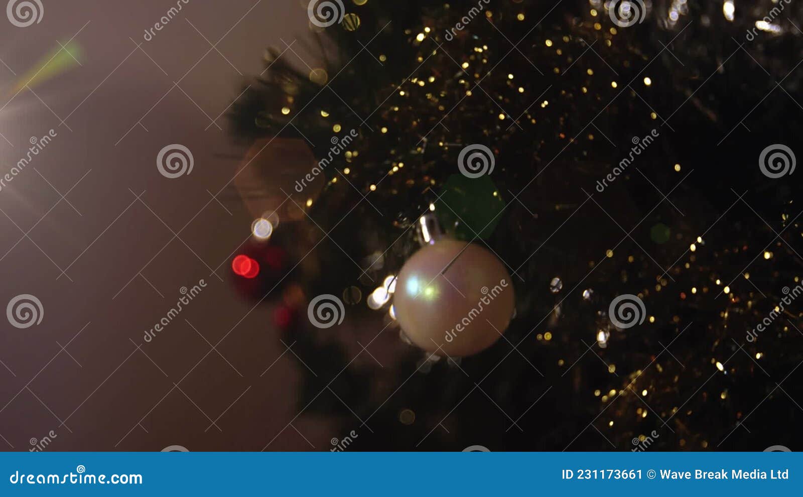 Animation of Light Moving Over Christmas Tree with Decorations Stock ...