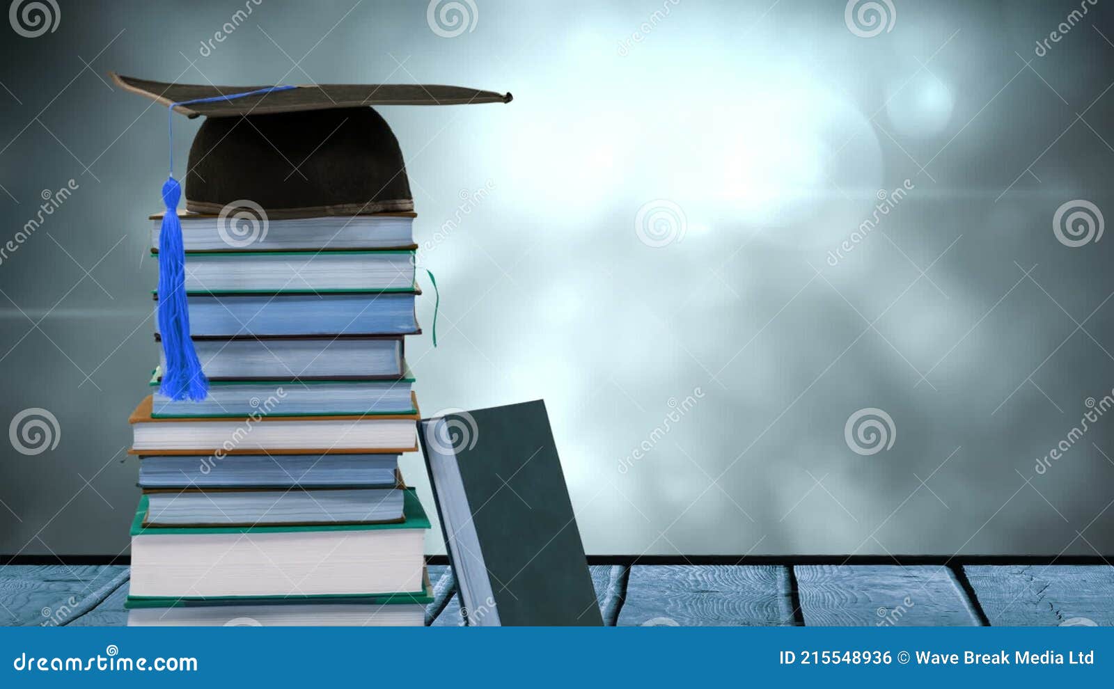Animation of Stack of Books with Graduation Hat on Top Over Glowing ...