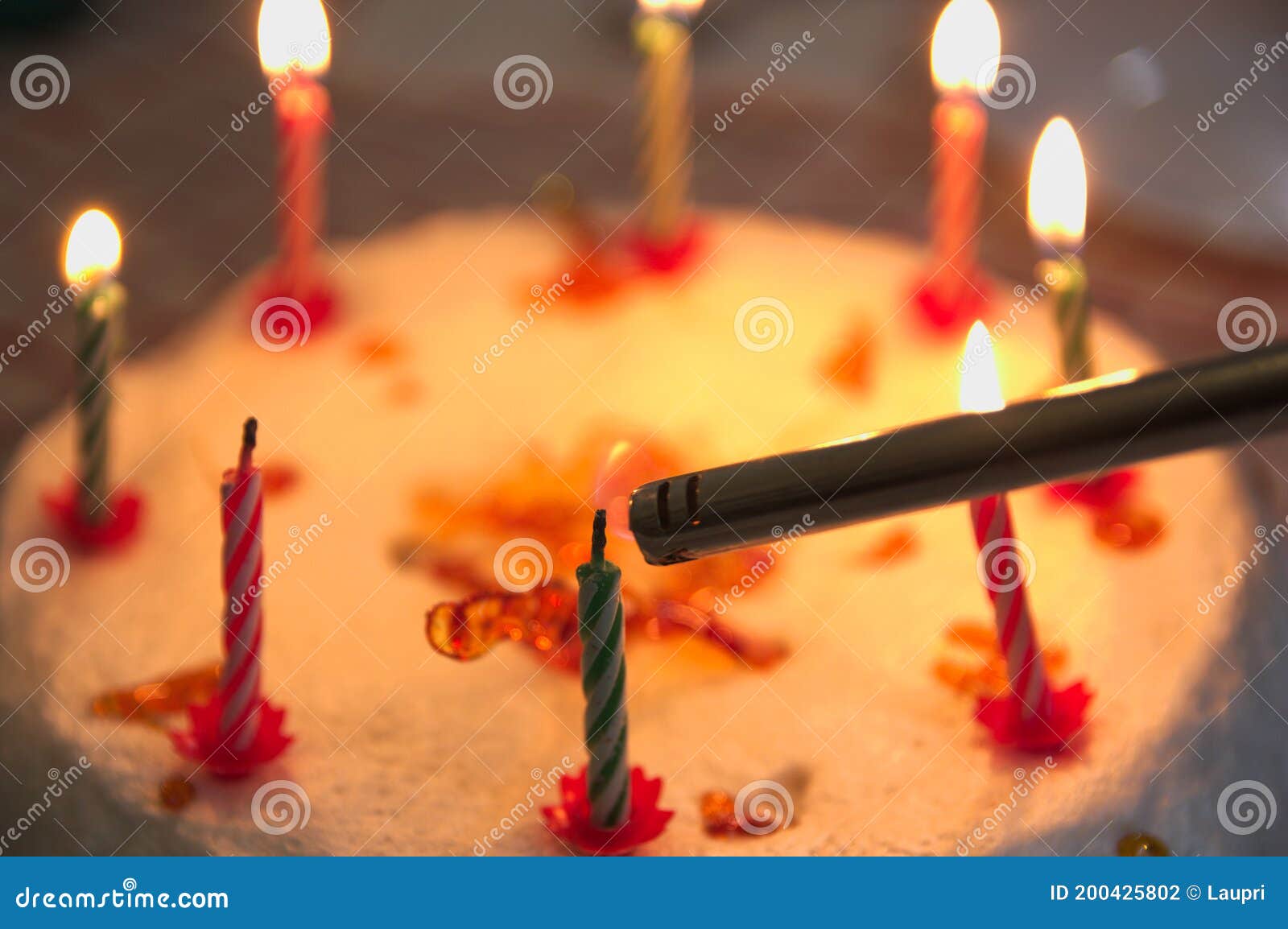 Anniversary Cake with Candles Lit by a Lighter Stock Photo - Image of ...