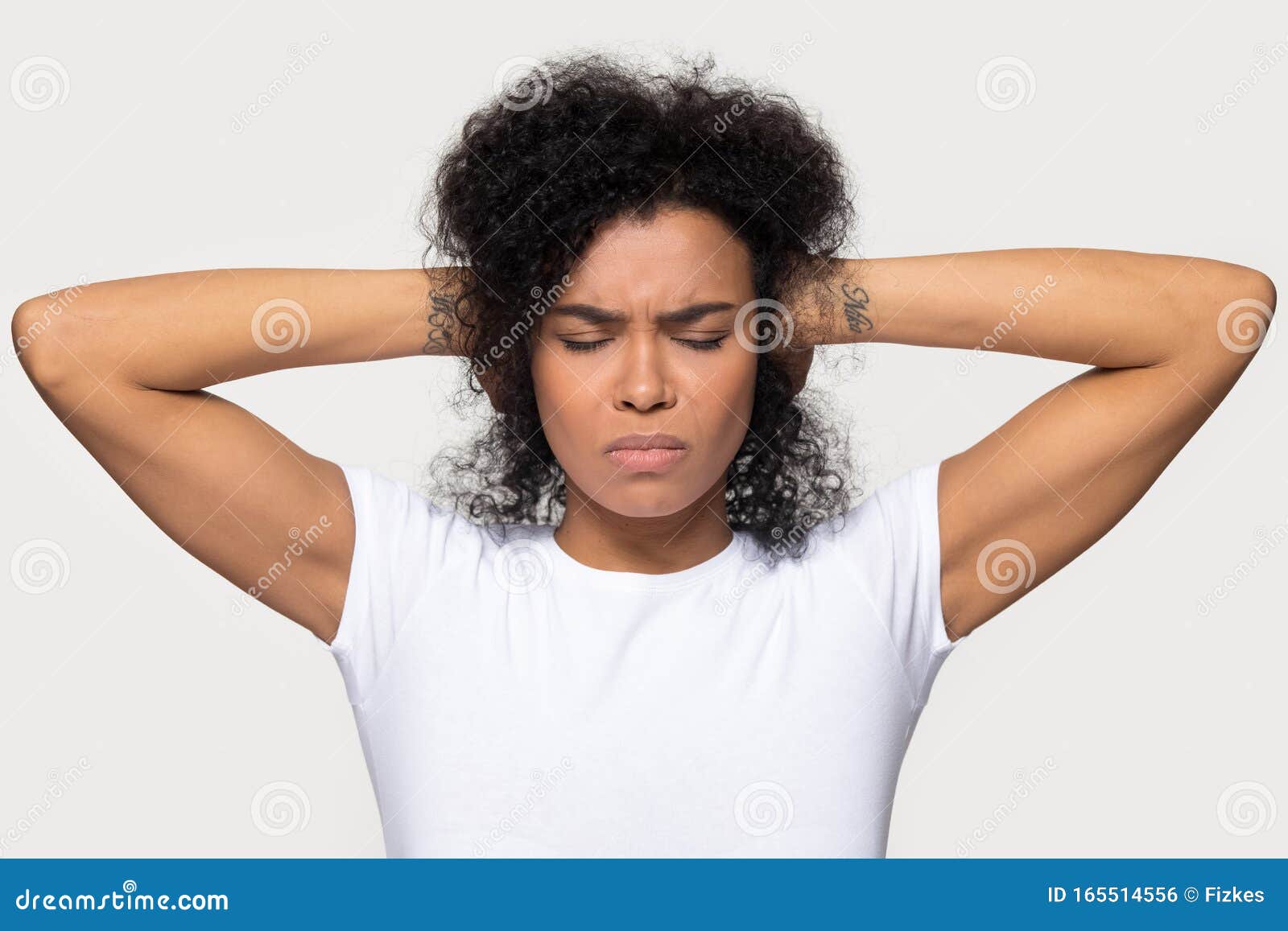 Annoyed African American Woman Covering Ears, Suffering from Noise ... Annoyed African American Woman Covering Ears, Suffering from Noise ...