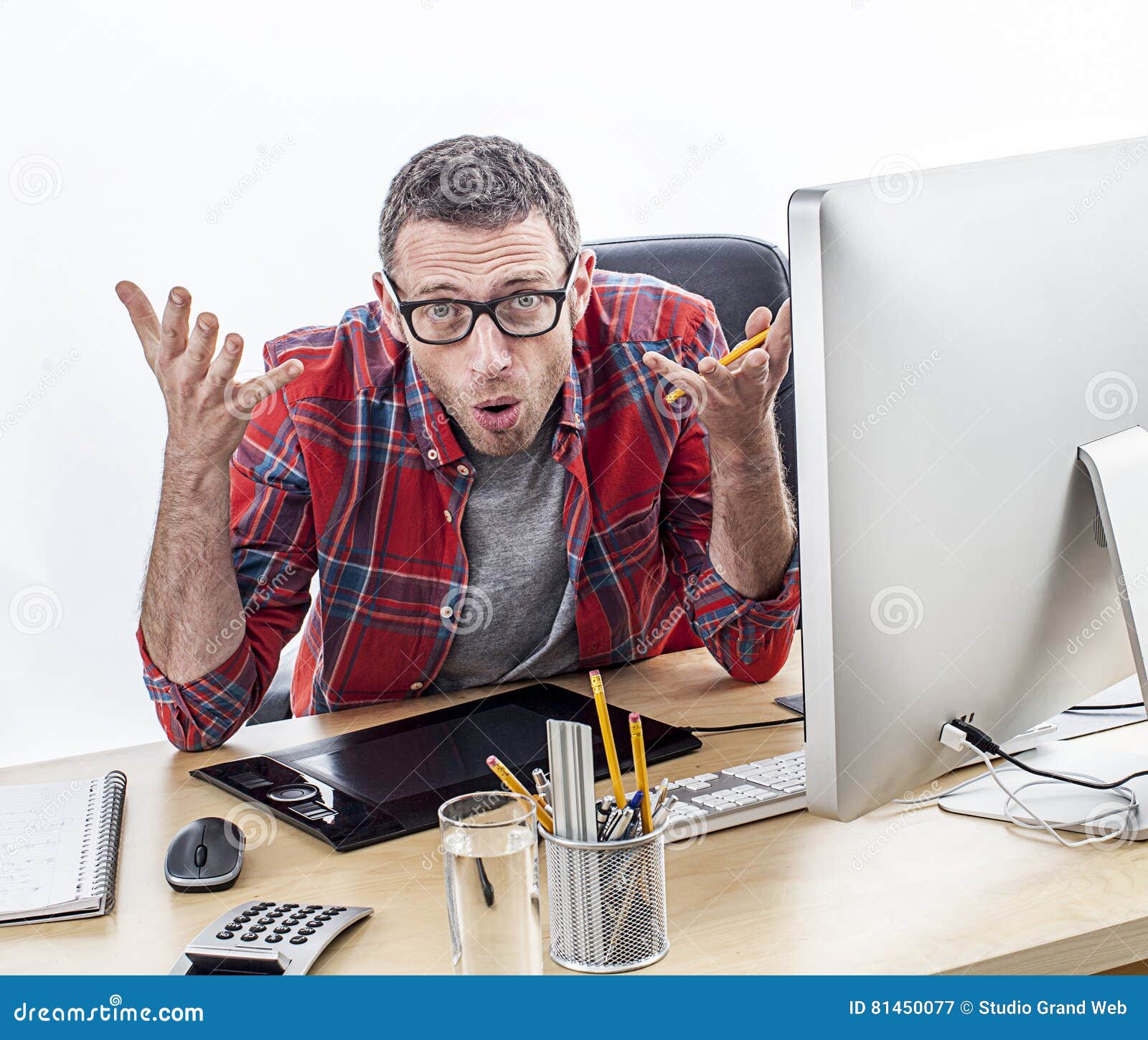 Annoyed Casual Business Man Complaining at His Desk, Expressing ... Annoyed Casual Business Man Complaining at His Desk, Expressing ...