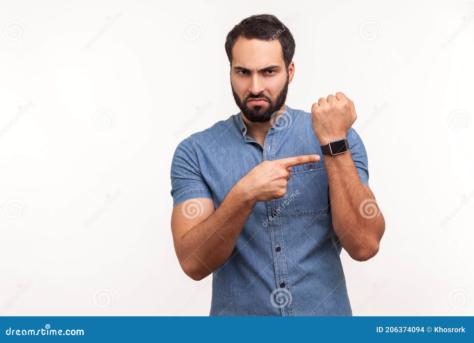 Annoyed Punctual Man with Beard in Blue Shirt Pointing Finger at Wrist ... Annoyed Punctual Man with Beard in Blue Shirt Pointing Finger at Wrist ...