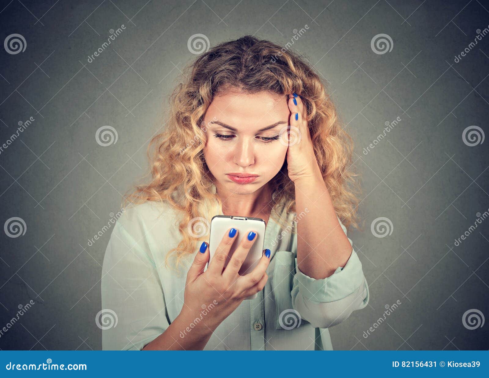 Annoyed Woman Off By What She Saw On Her Cell Phone Stock Image