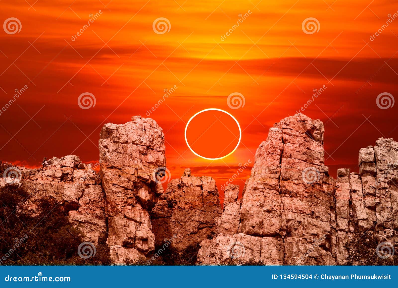 Annular Eclipse Over Stone on the Rock of Cliff Stock Photo - Image of ...