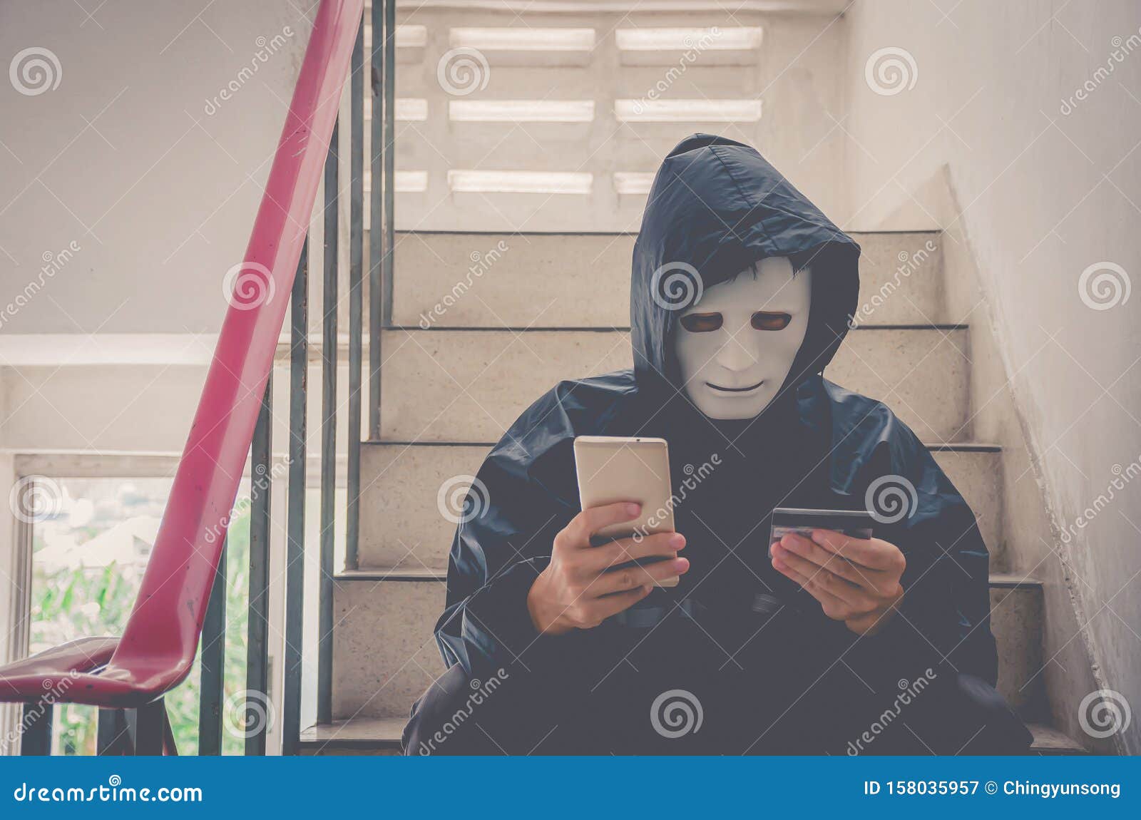 Anonymous Computer Hacker in White Mask and Hoodie, Hacker Holding ...