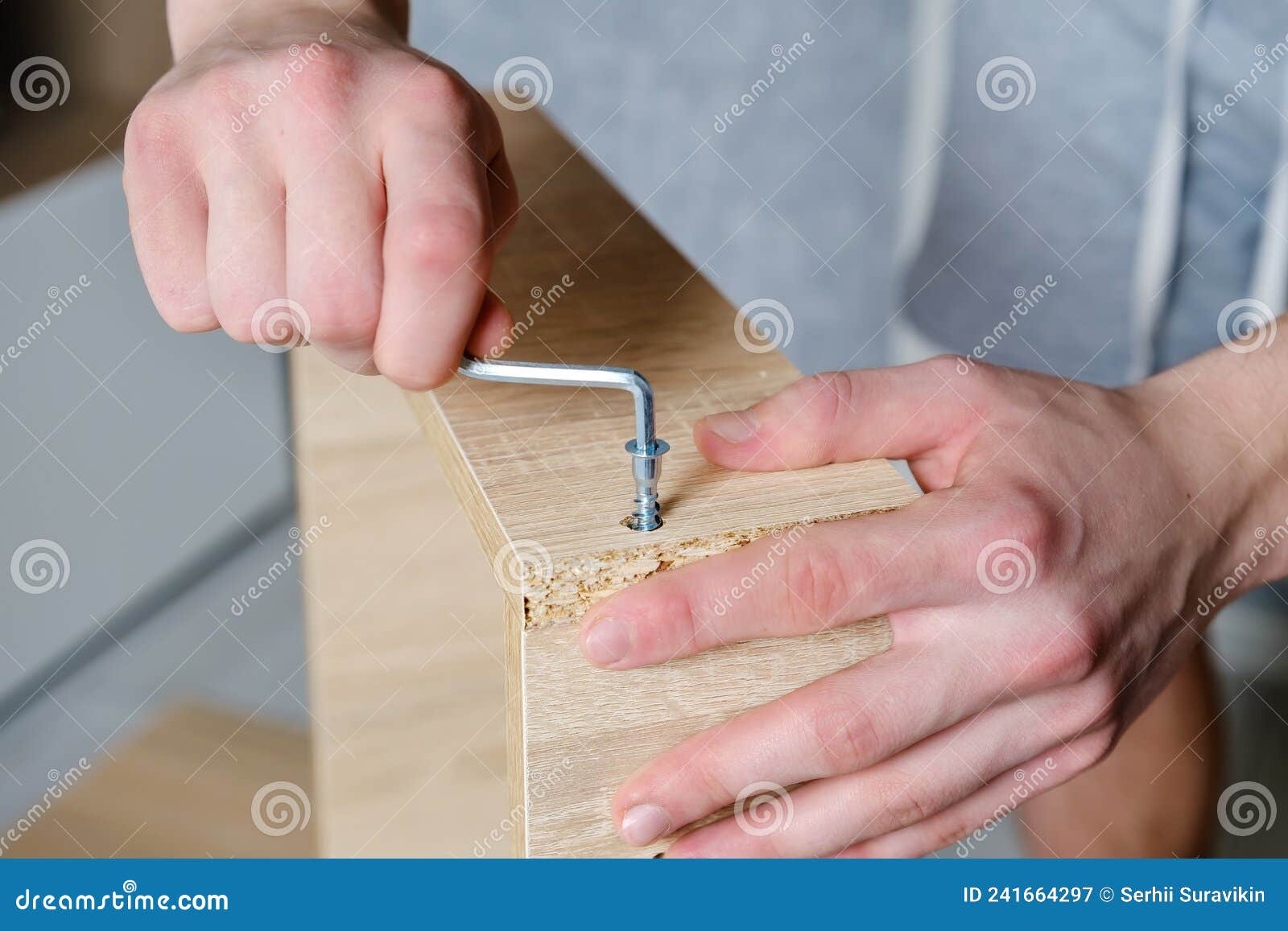 Anonymous Craftsman Using Screwdriver For Work With Wooden Furniture