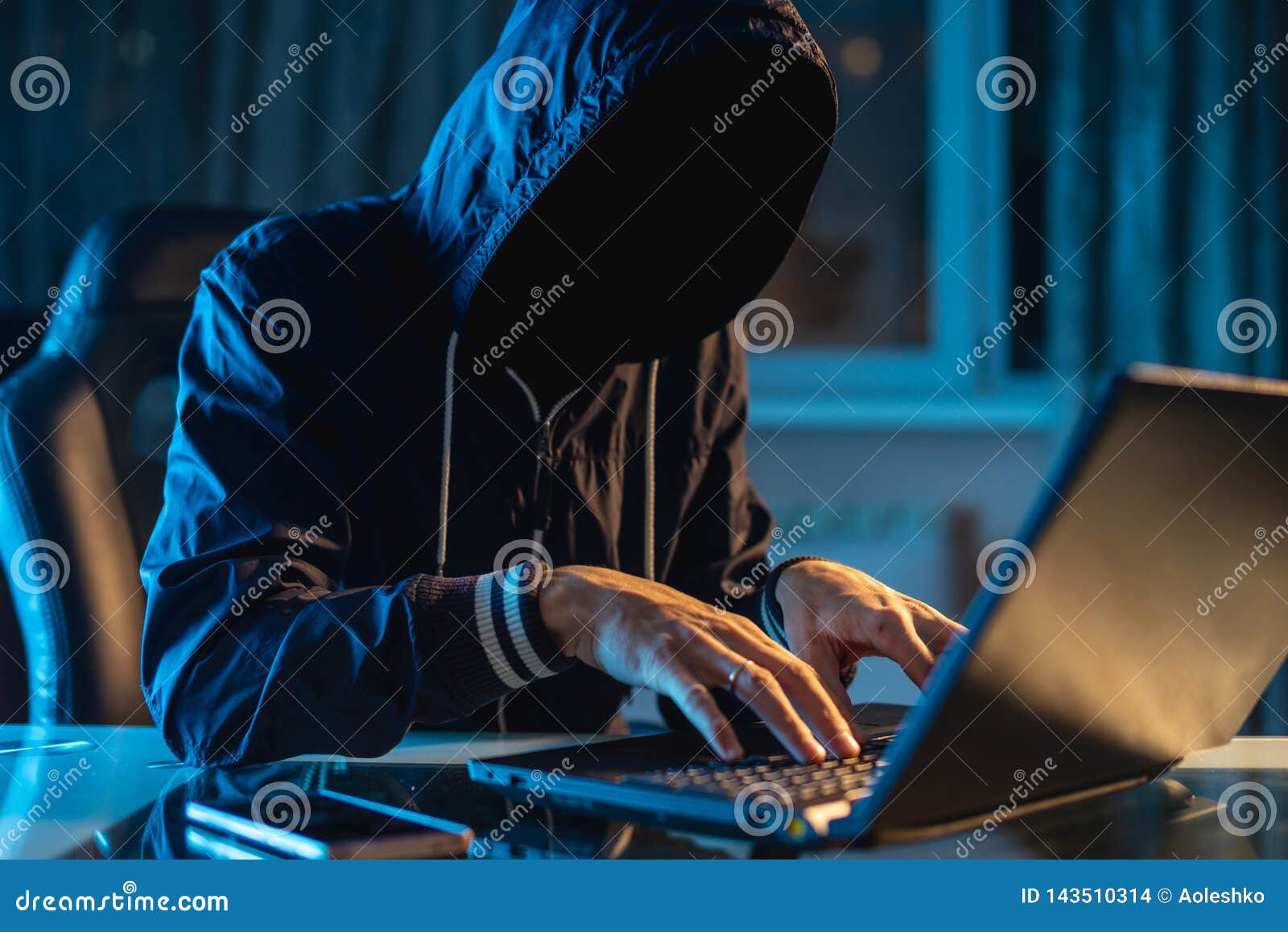 Anonymous Hacker Programmer Uses A Laptop To Hack The System In The