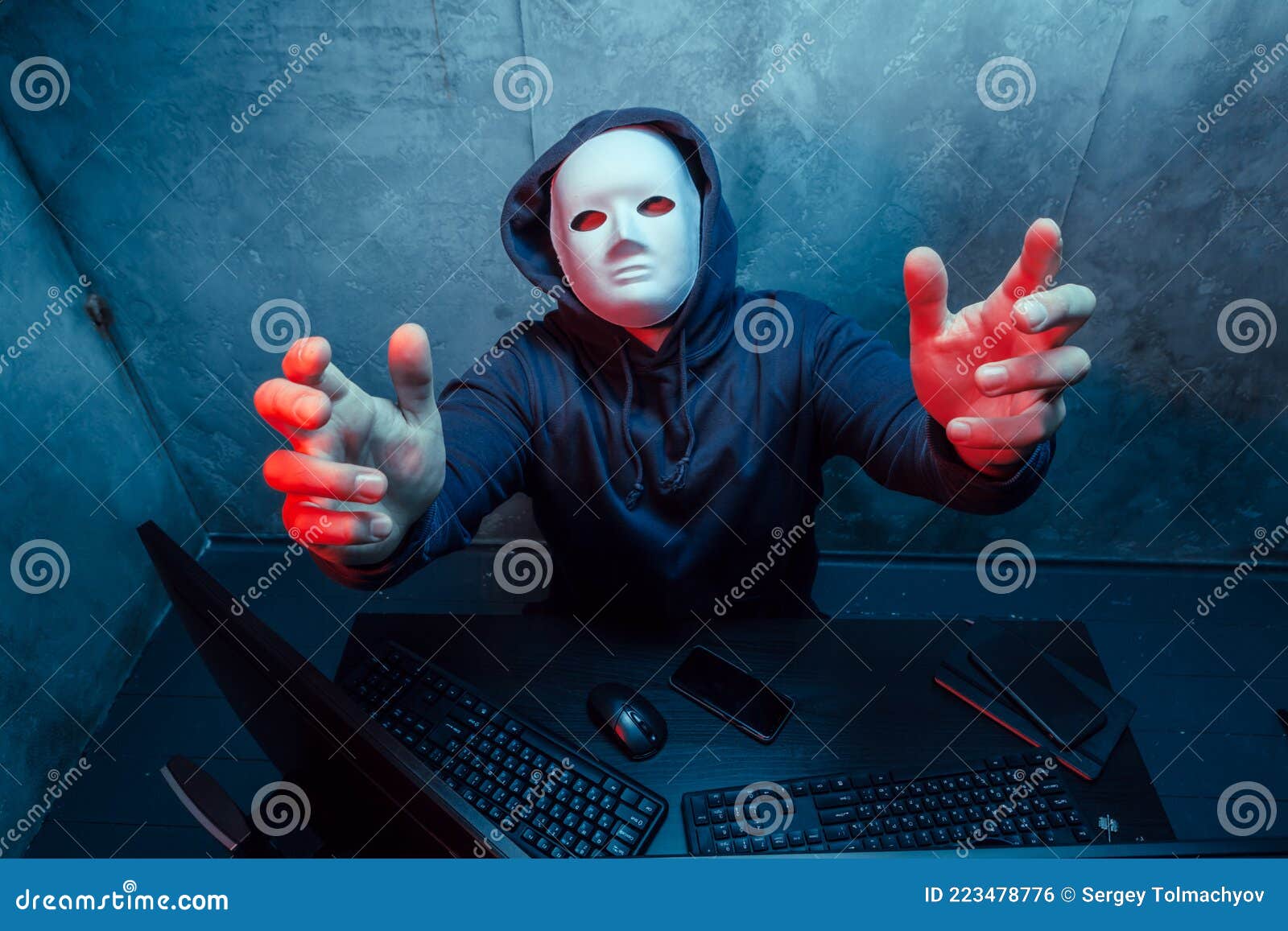 Anonymous Hacker Wearing Face Mask Working on Computer in Dark Room ...