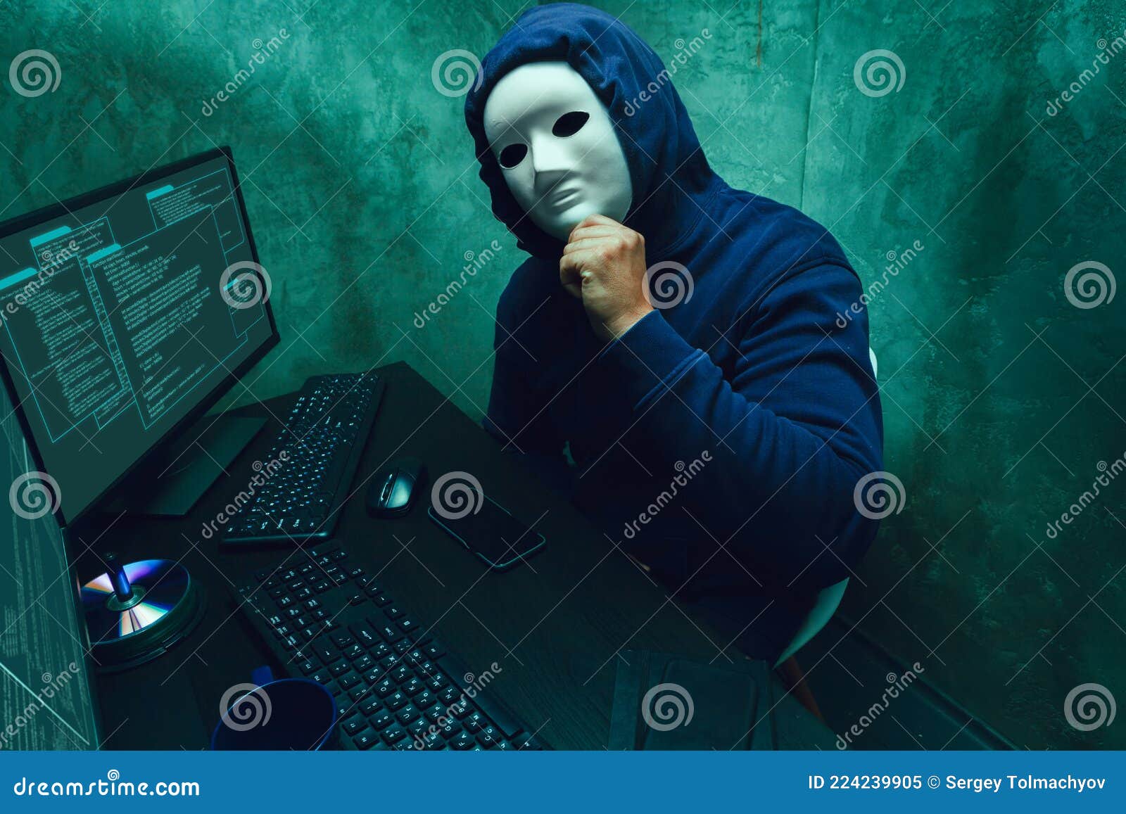 Anonymous Hacker Wearing Face Mask Working on Computer in Dark Room ...