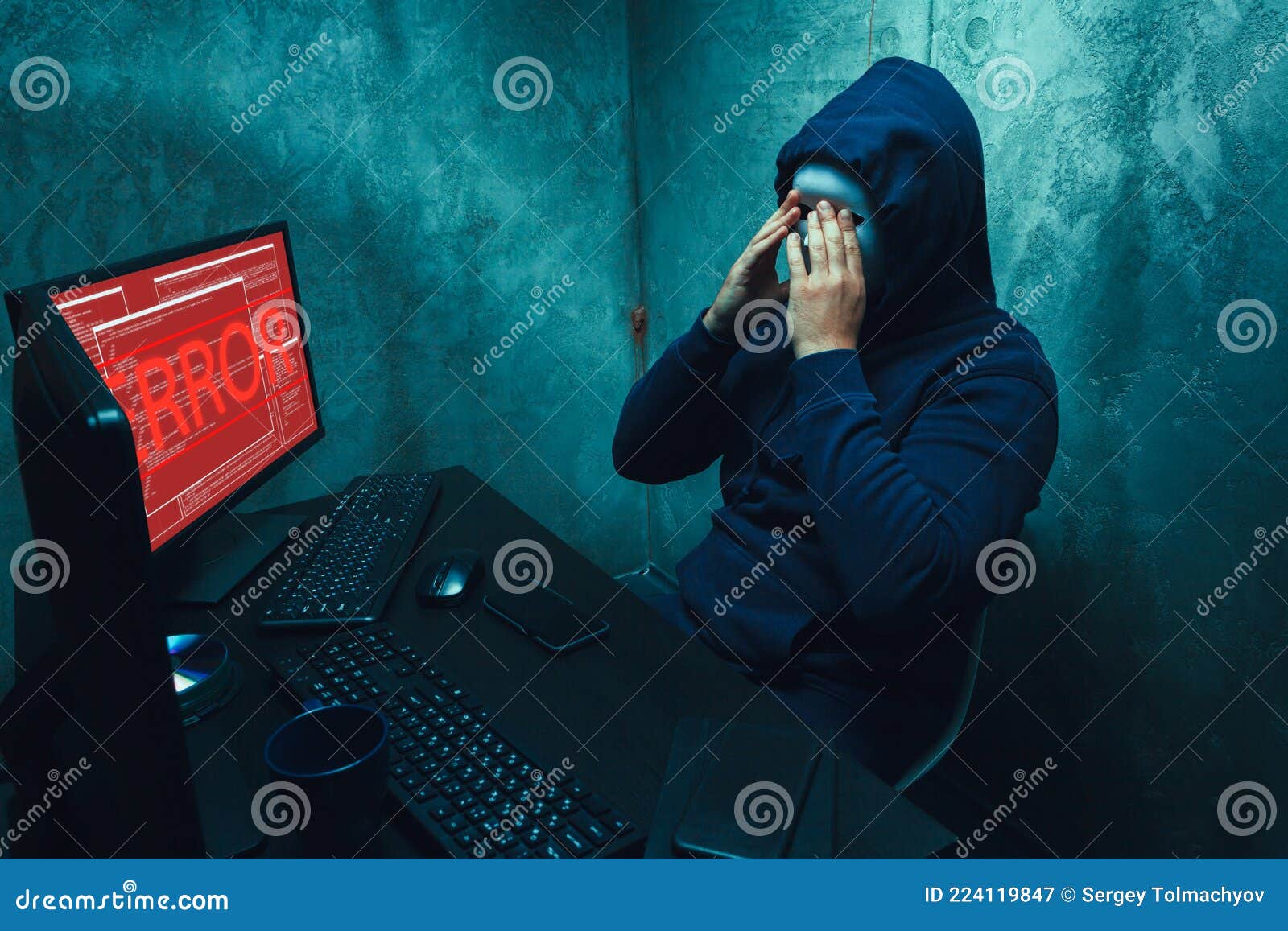 Anonymous Hacker Wearing Face Mask Working on Computer in Dark Room ...