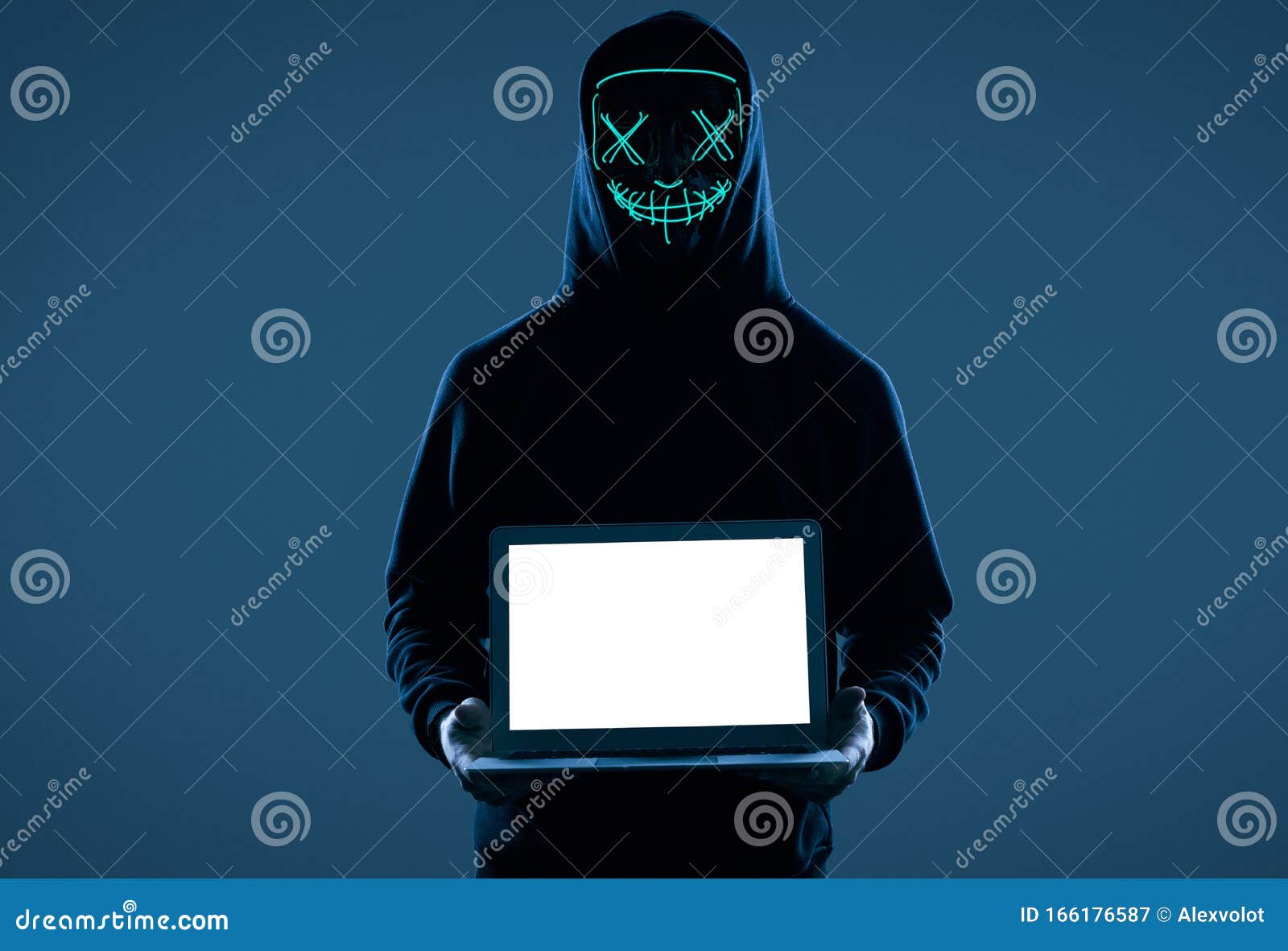 Anonymous Man in a Black Hoodie and Neon Mask Hacking into a Computer ...