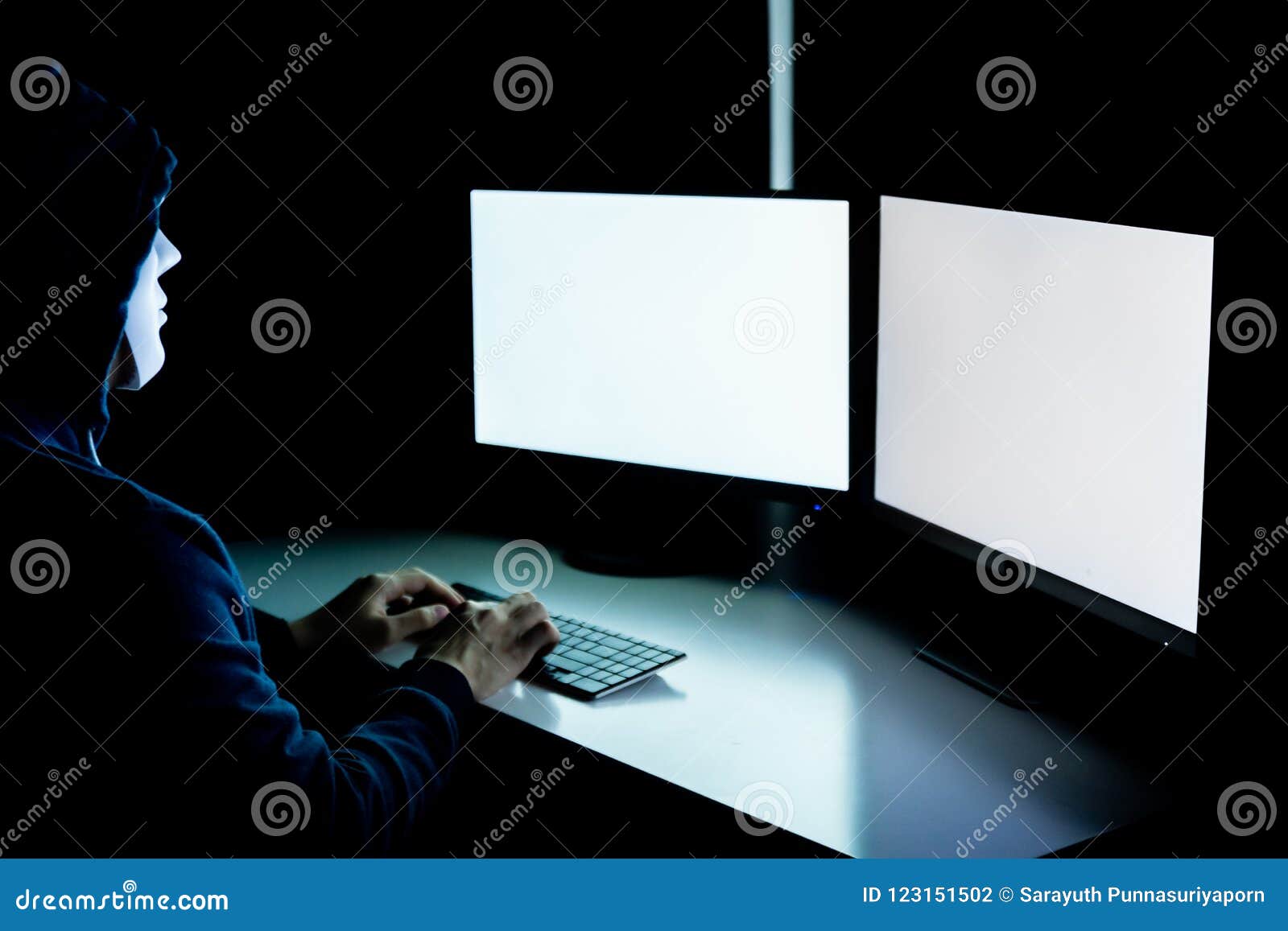 Anonymous and Masked Hacker Using Computer with Isolated White Monitor ...