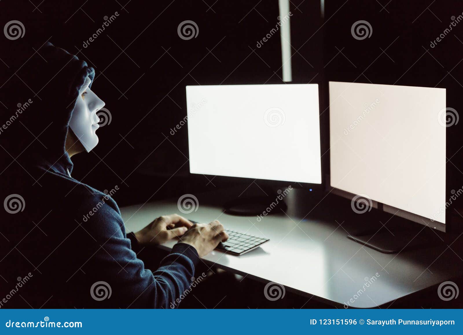 Anonymous And Masked Hacker Using Computer With Isolated White Monitor ...