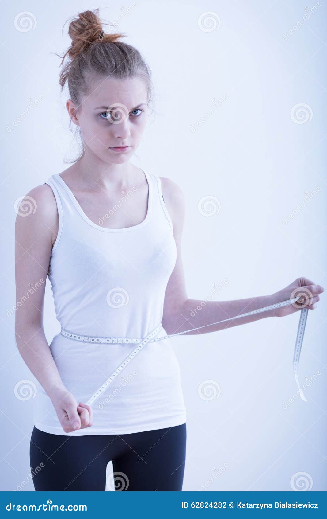 Anorexic Girl Looking At A Scale Royalty-Free Stock Image ...