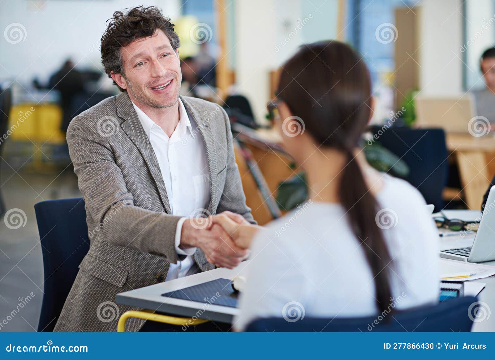 Another Job Well Done. Colleagues Shaking Hands in an Office. Stock ...
