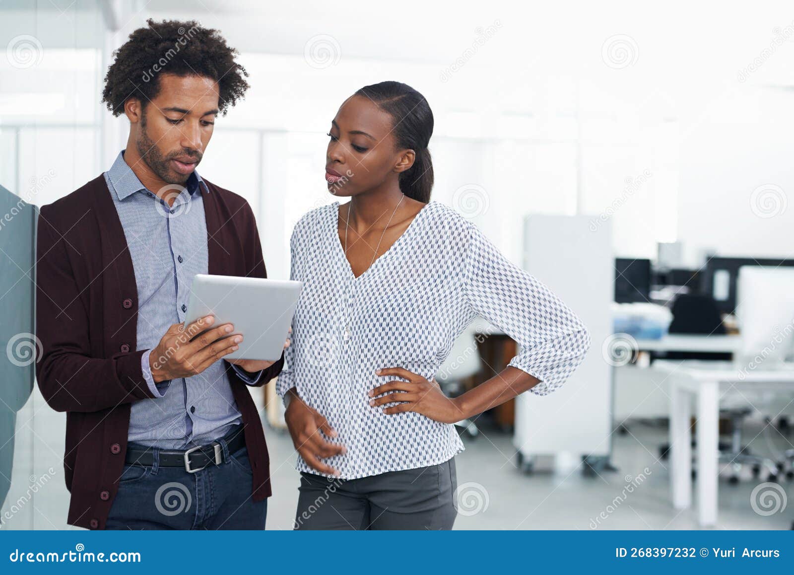 Another Practical Use for Technology in the Workplace. Two Colleagues ...