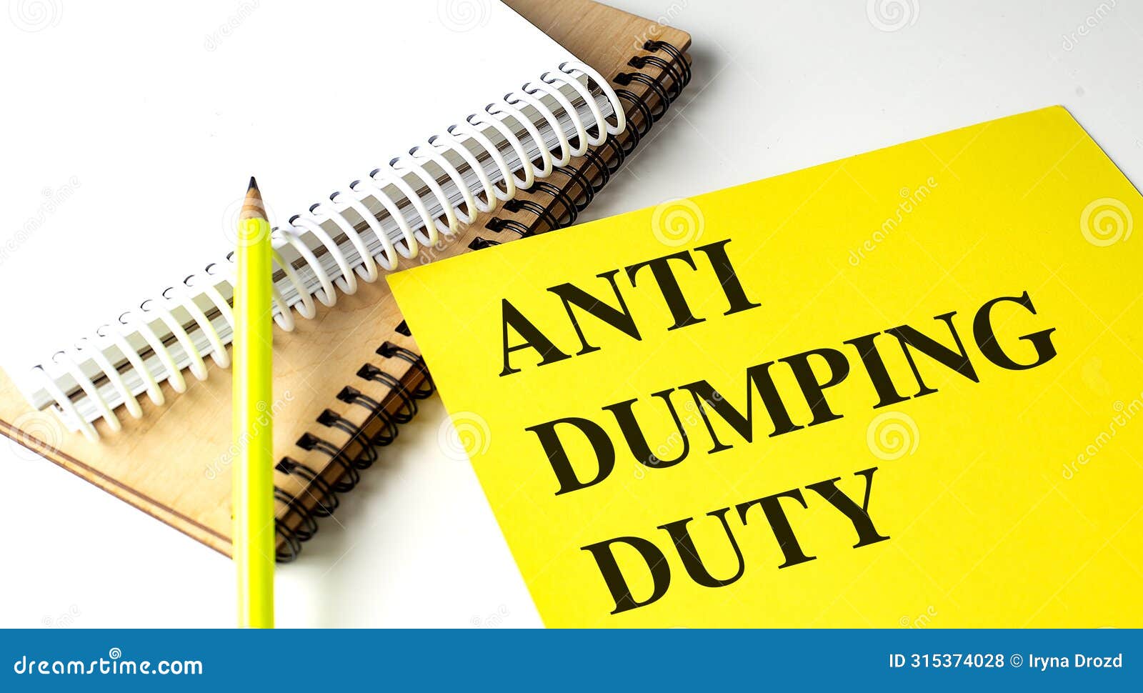 ANTI DUMPING DUTY Text on Yellow Paper with Notebooks Stock Photo ...