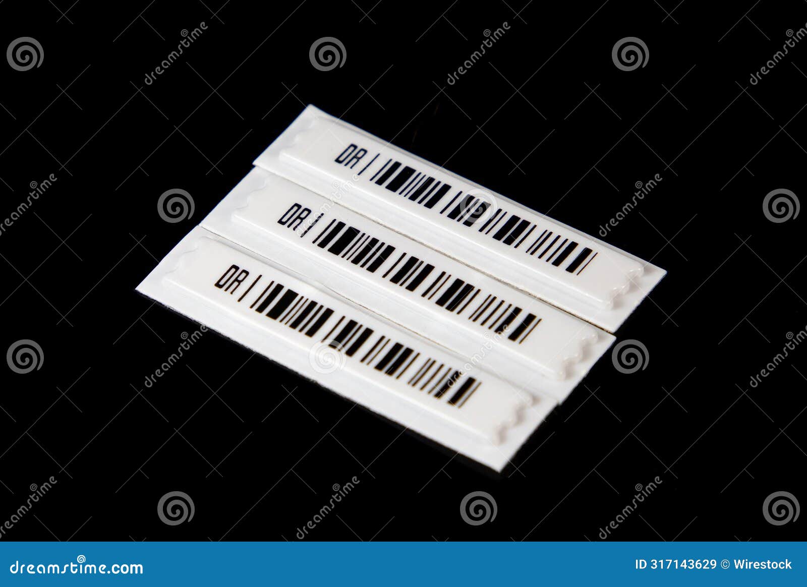 Anti-theft Magnetic Barcode Labels on a Black Background. Stock Image ...