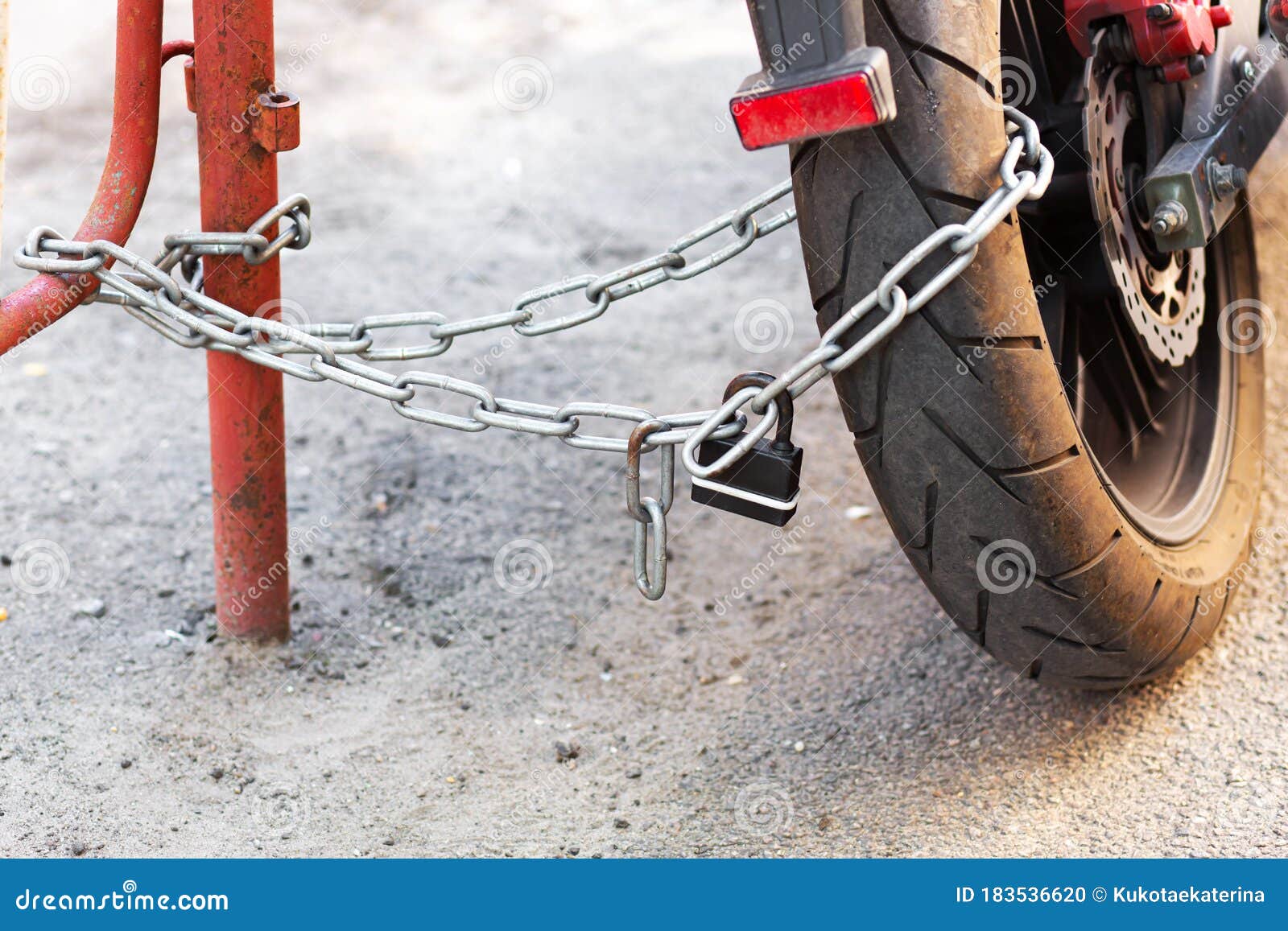 Anti-theft System of the Bike. Fasten the Bike To the Pole Stock Photo ...